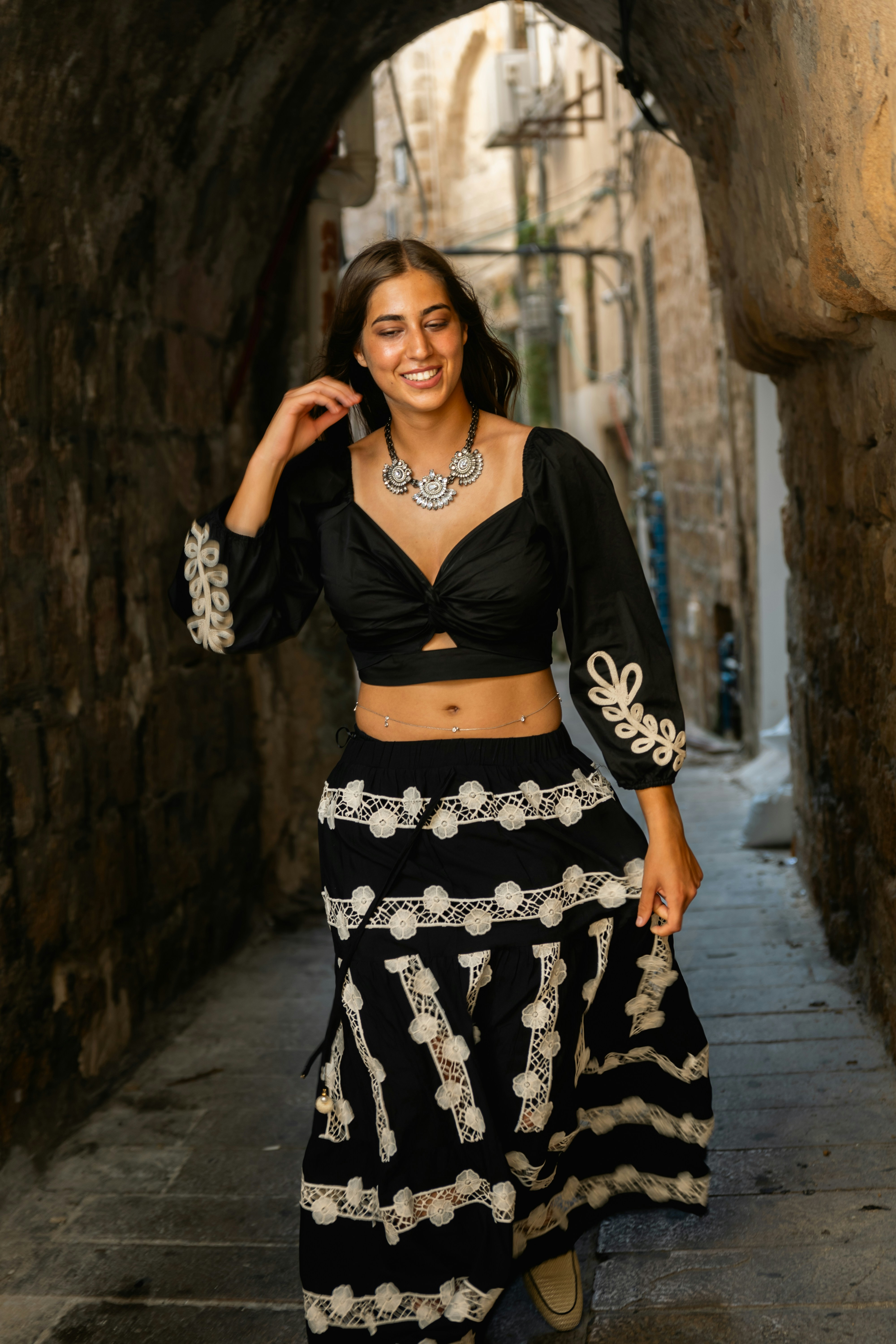 Bohemian Grace Through a Stone Archway