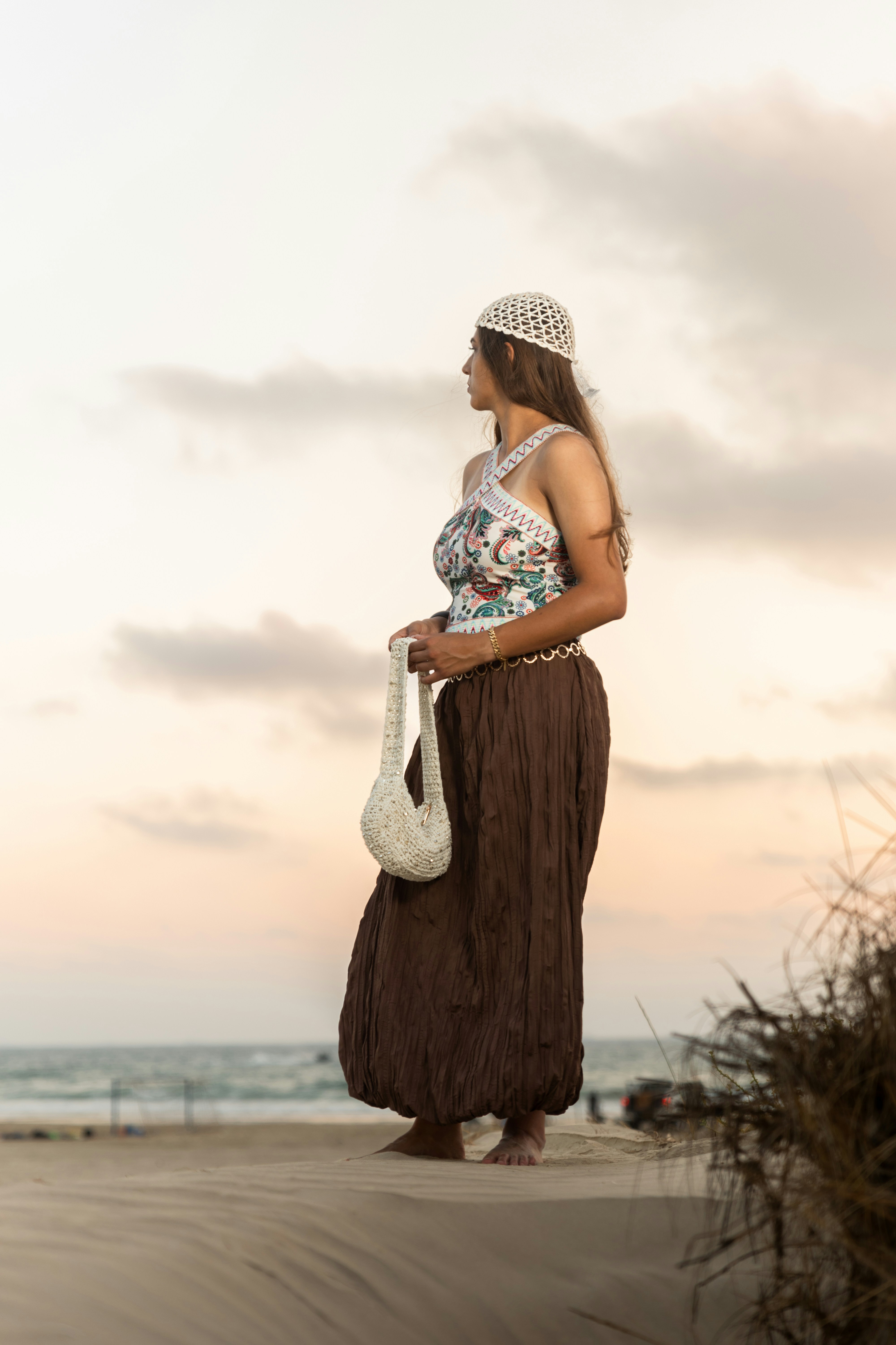 Dusk Dune Portrait: A Beach Wanderer in Crochet Hat