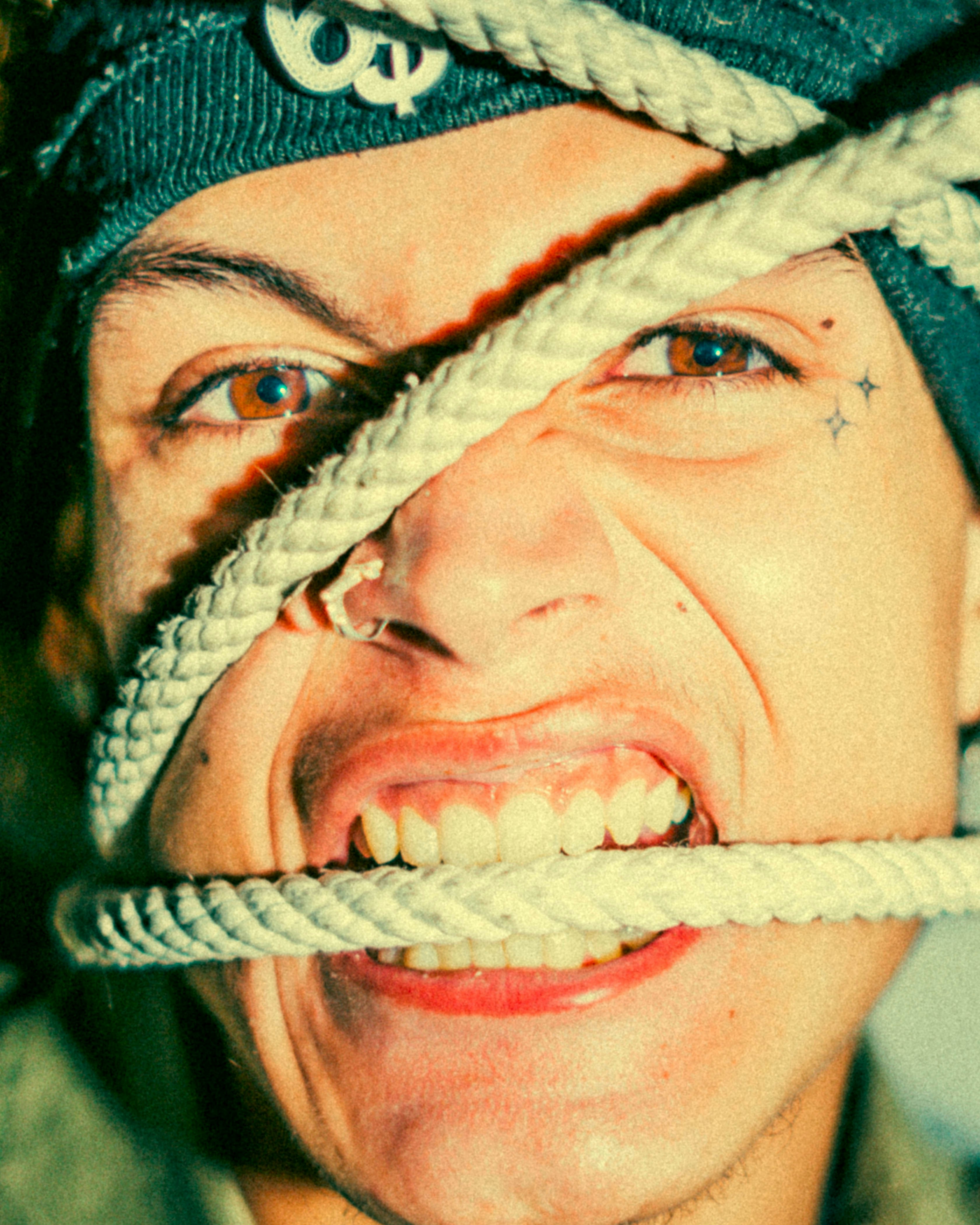Ropebound Grin: A Ferocious Close-Up of a Defiant Expression