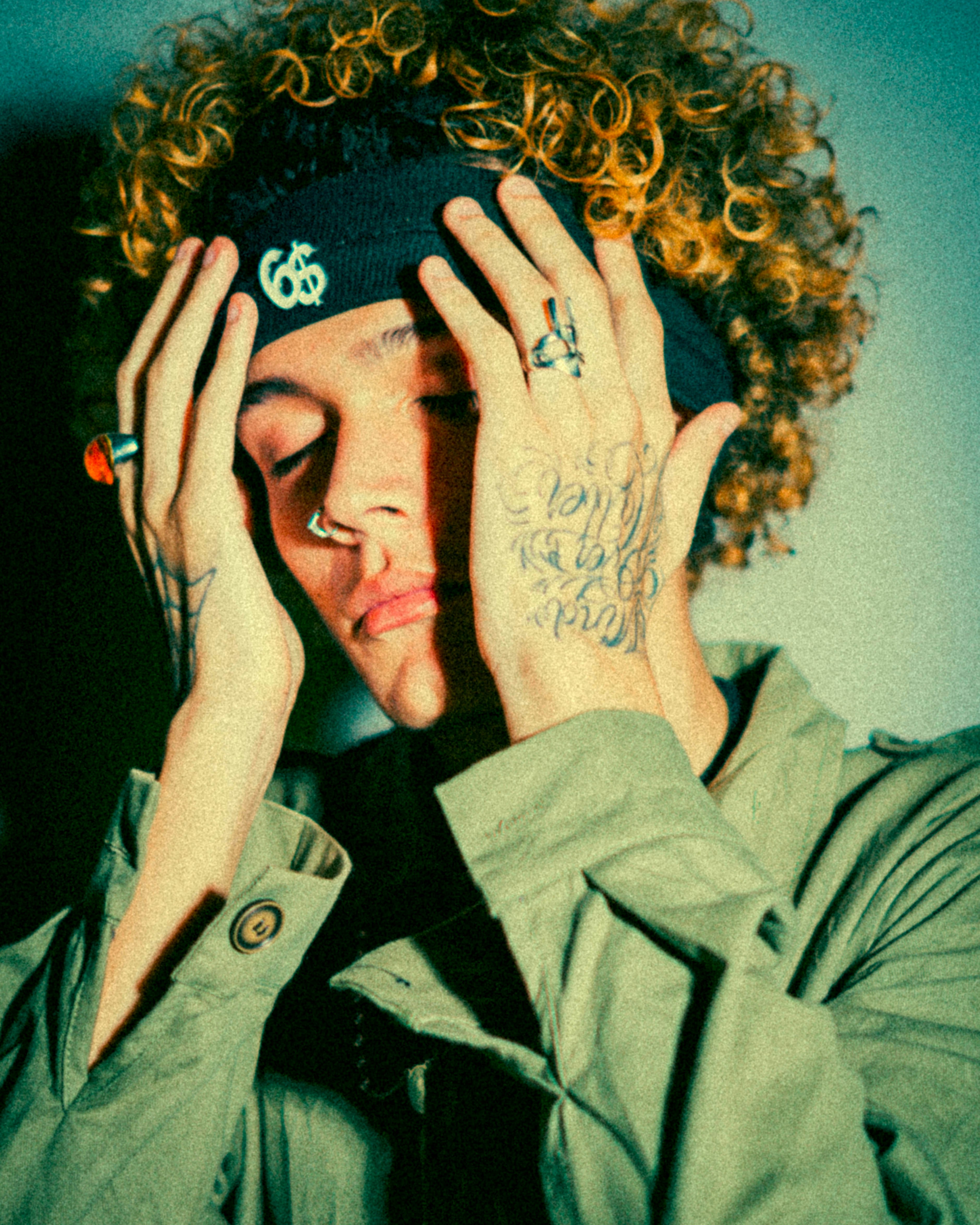 Ink and Quiet: A Neon Portrait of a Tattooed Moment