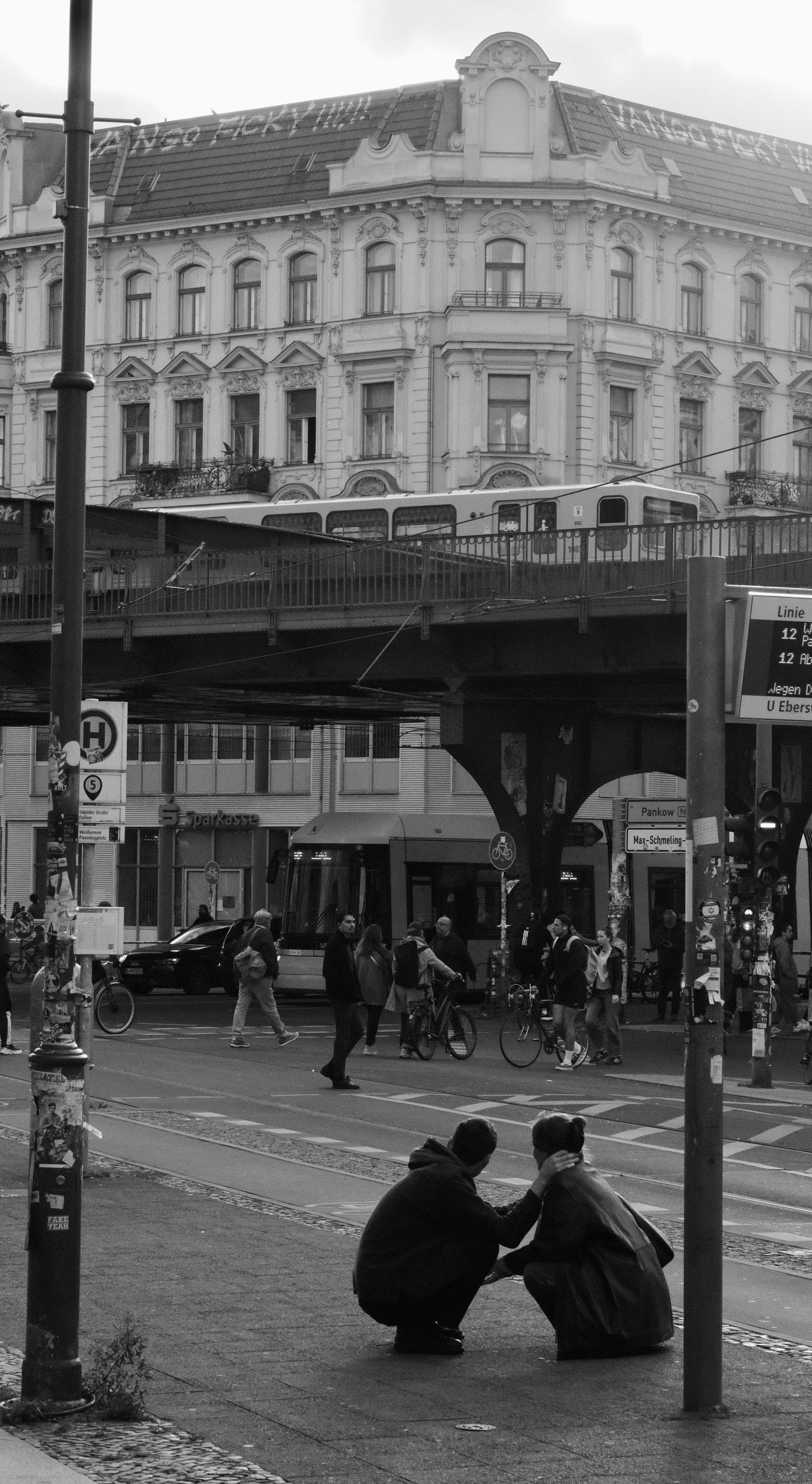 Whisper on the Pavement: Two Figures in a Monochrome City Under the Bridge