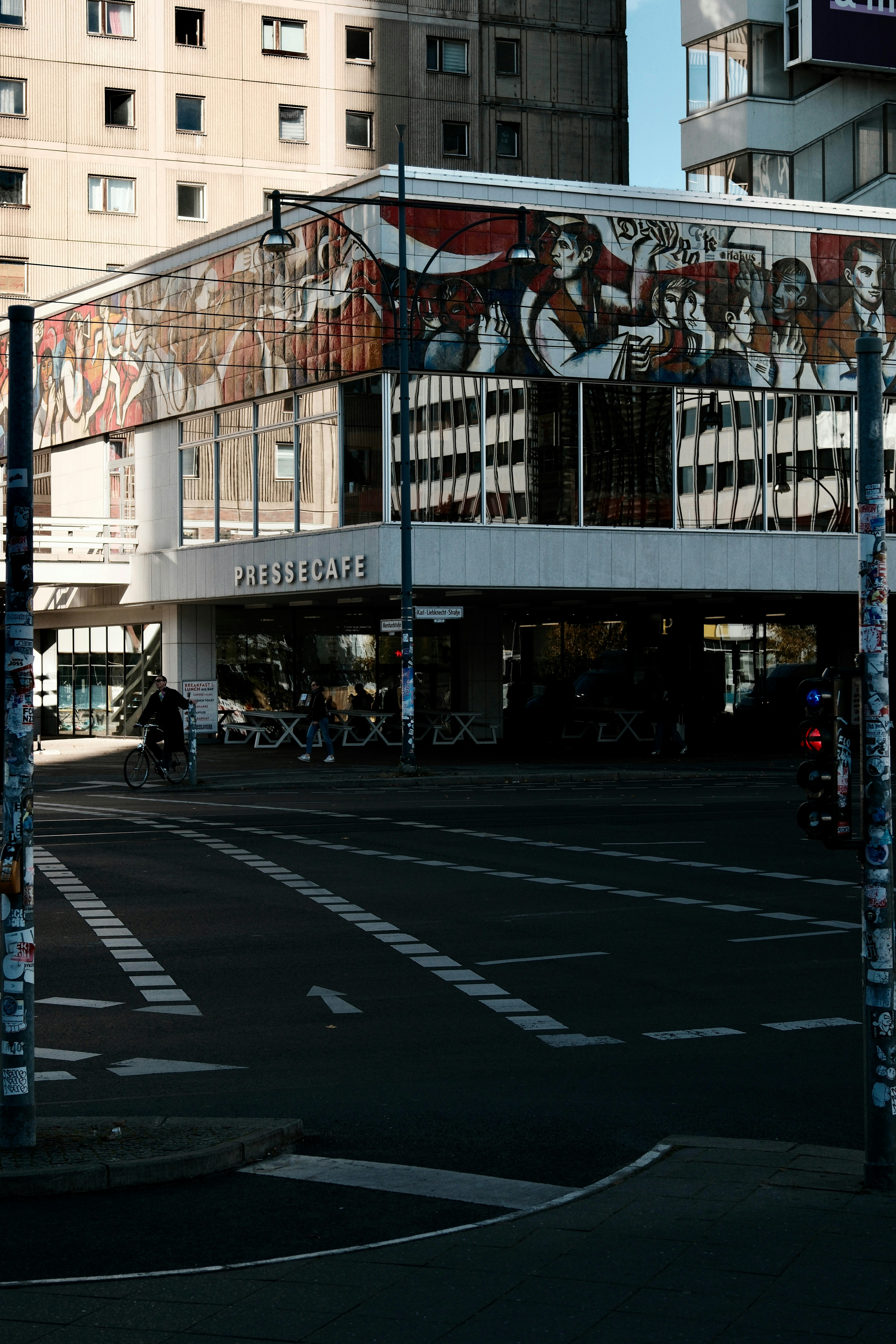 Mural Corridor Over PresseCafe: A Street-Level City Portrait