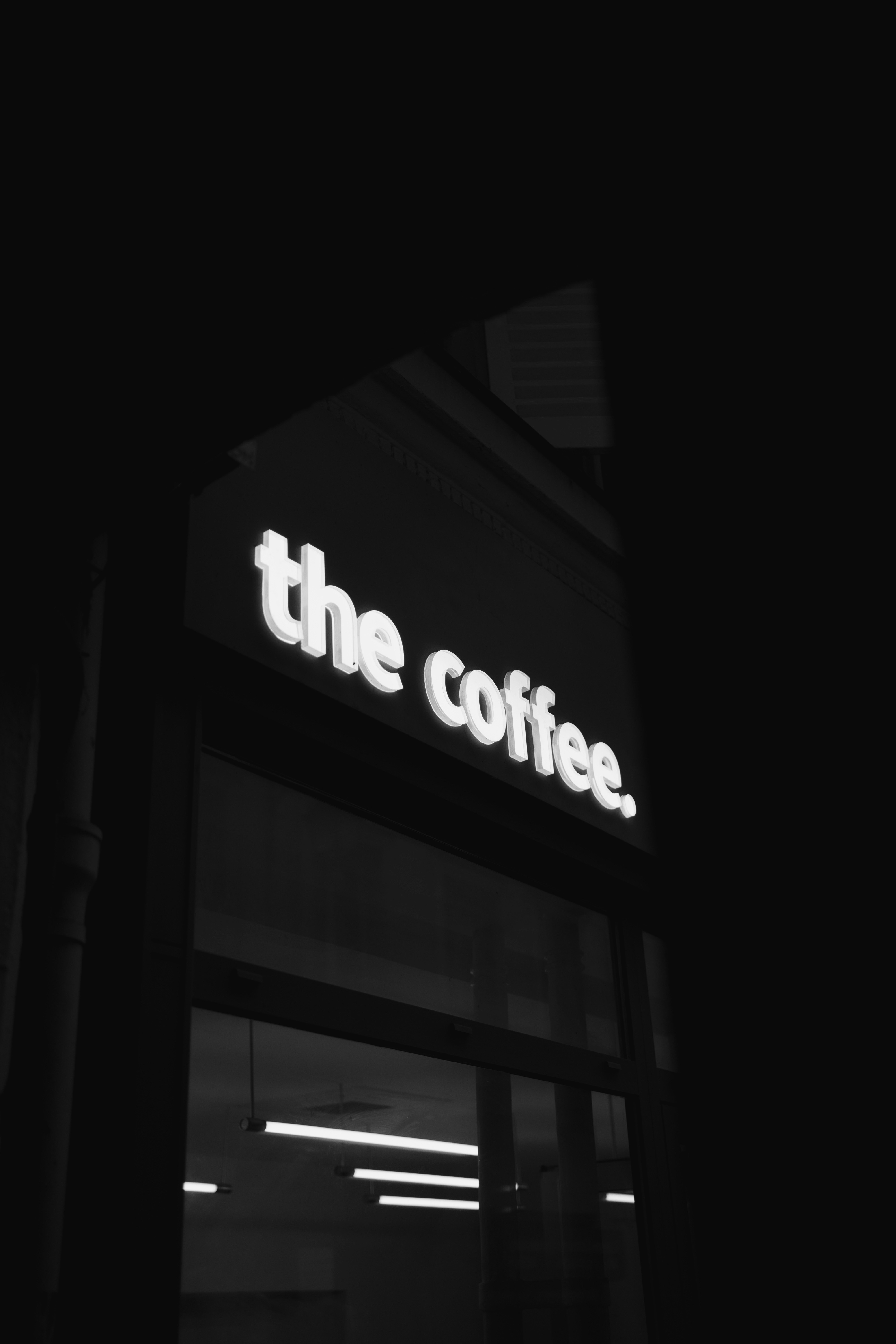 Midnight Glow Over a Quiet Coffee Sign