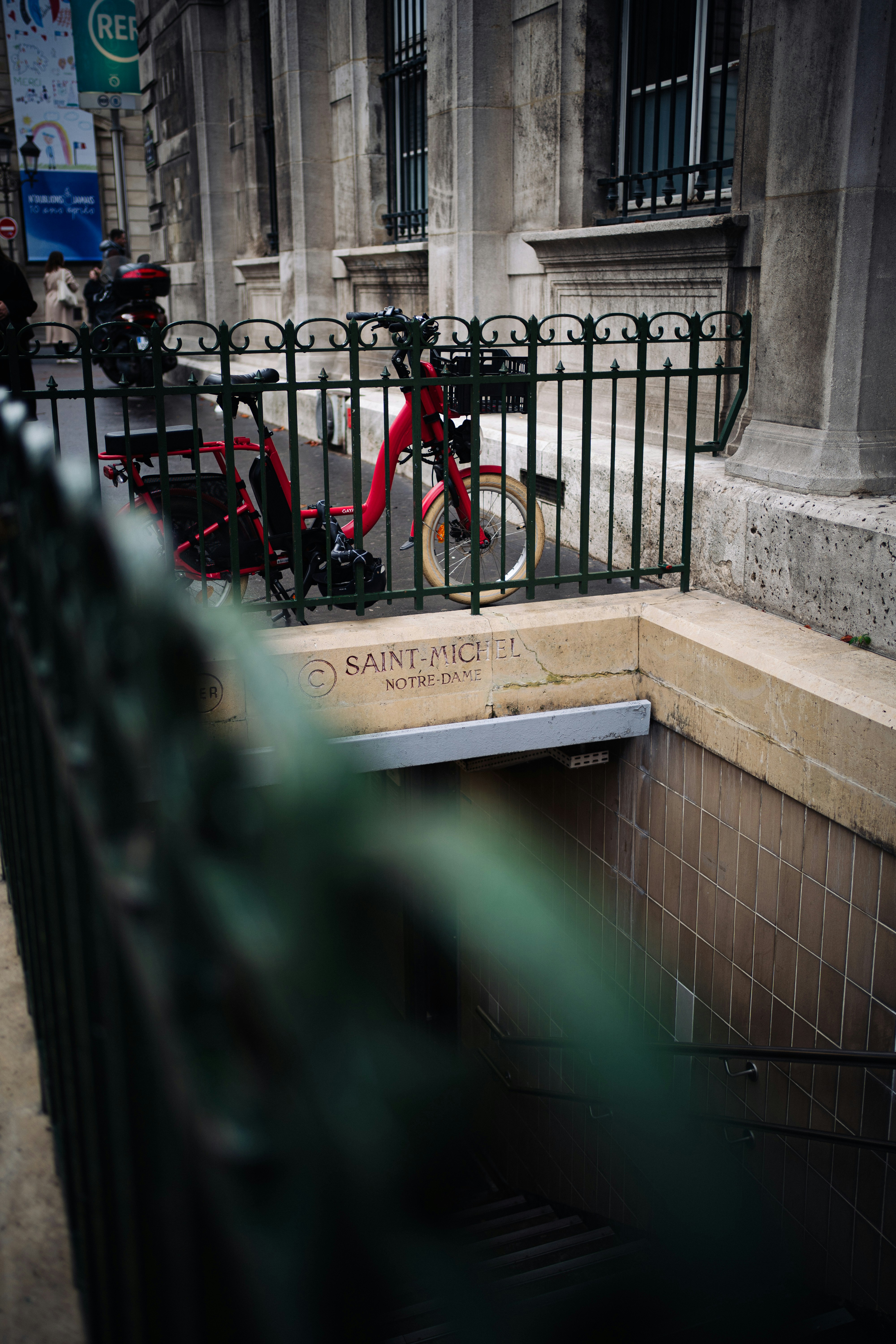 Red bicycle near saint-michel metro entrance in paris. photo – Free ...
