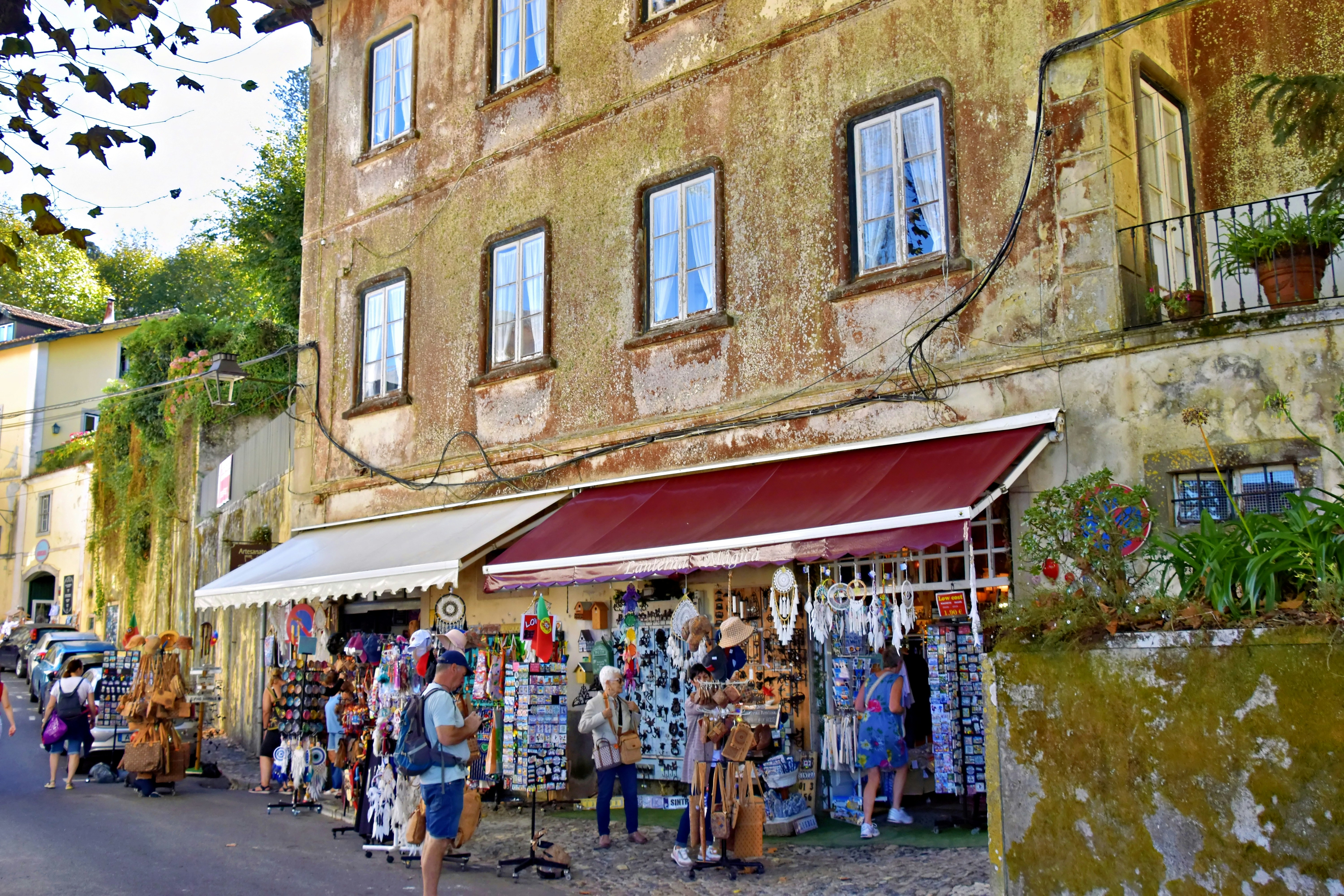 Sunlit Market Row Beneath a Weathered Façade