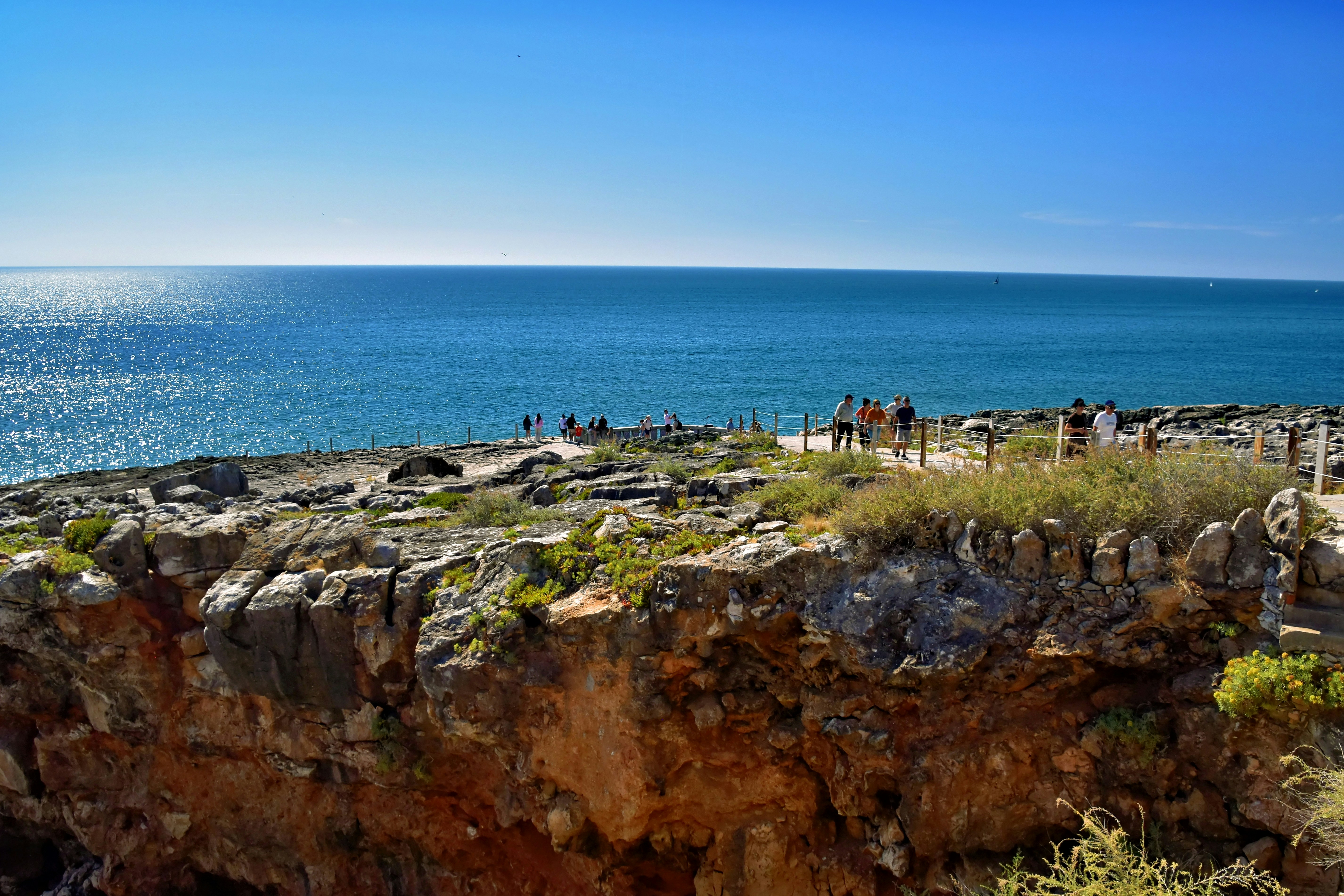 Sunlit Promenade Over a Cliffside Seascape