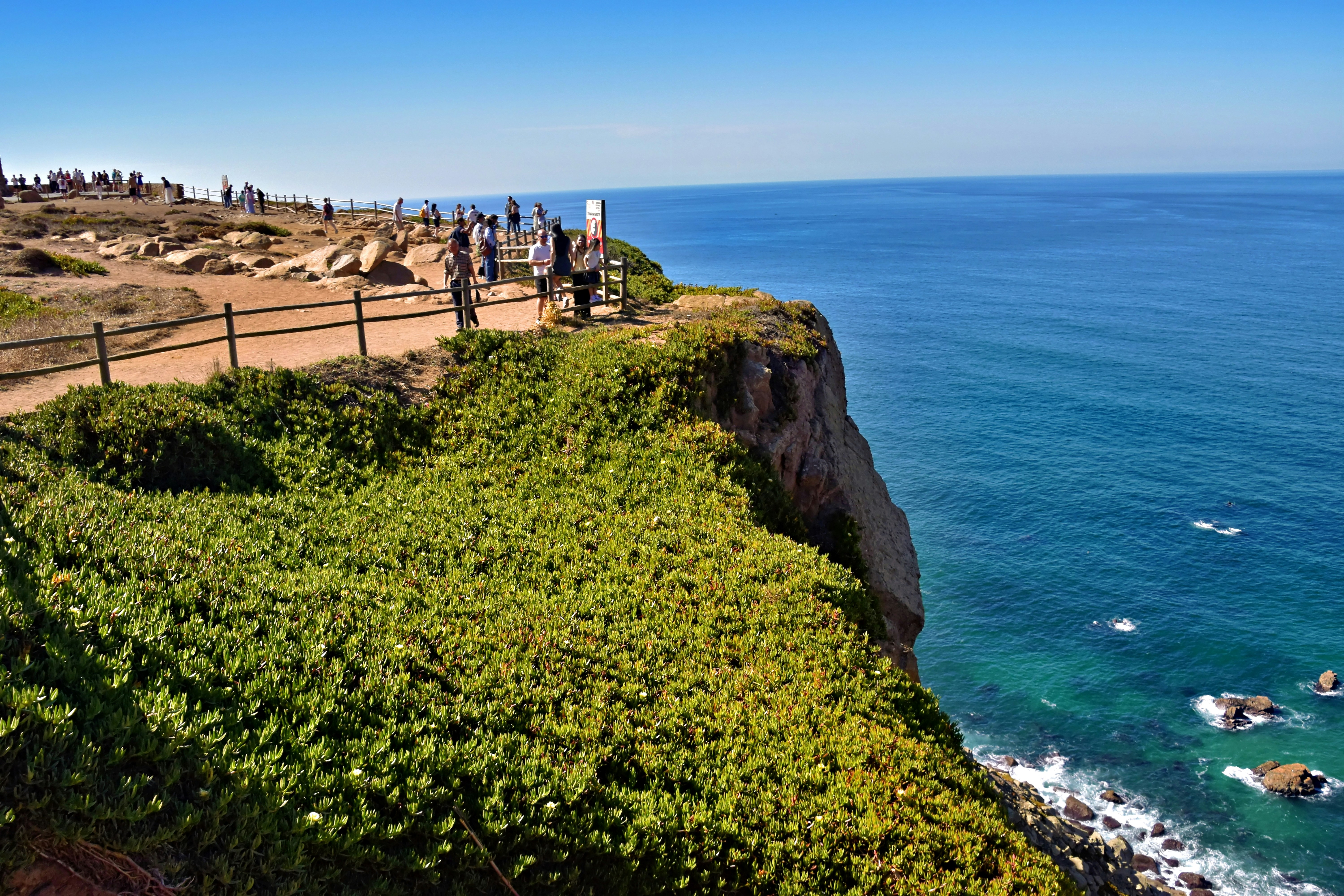 Edge of the Atlantic: Visitors Atop a Cliffside Overlook