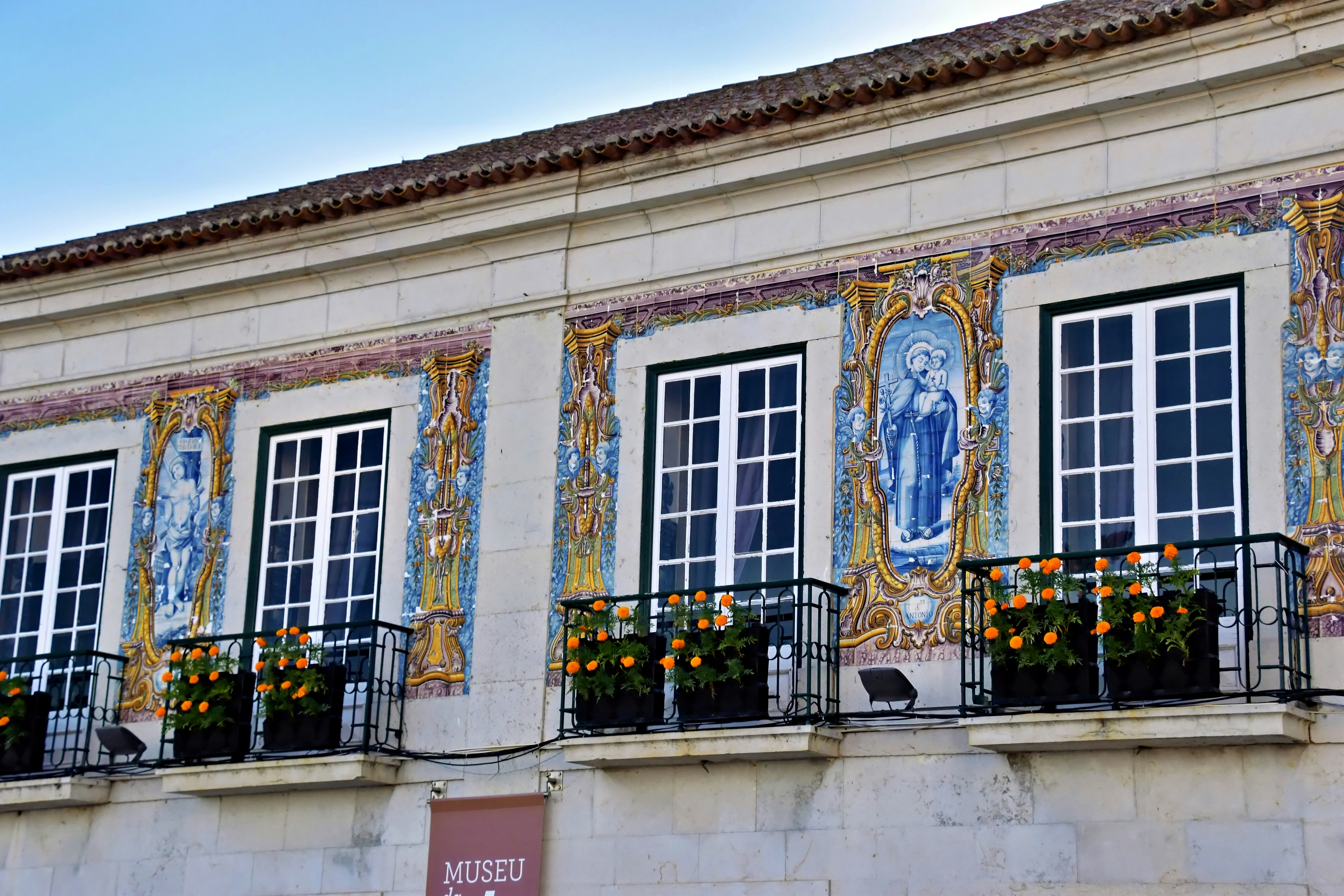 Tiles, Balconies, and Blooming Frames: A Sunlit Museum Façade
