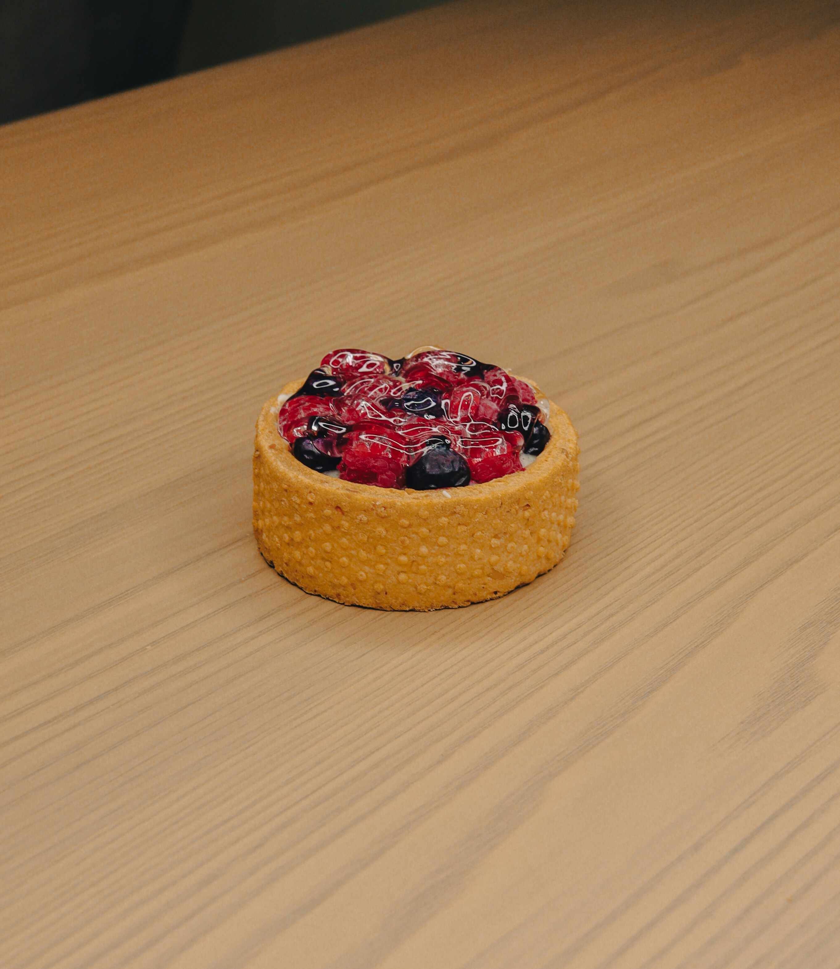 Berry Tart on a Quiet Wooden Table