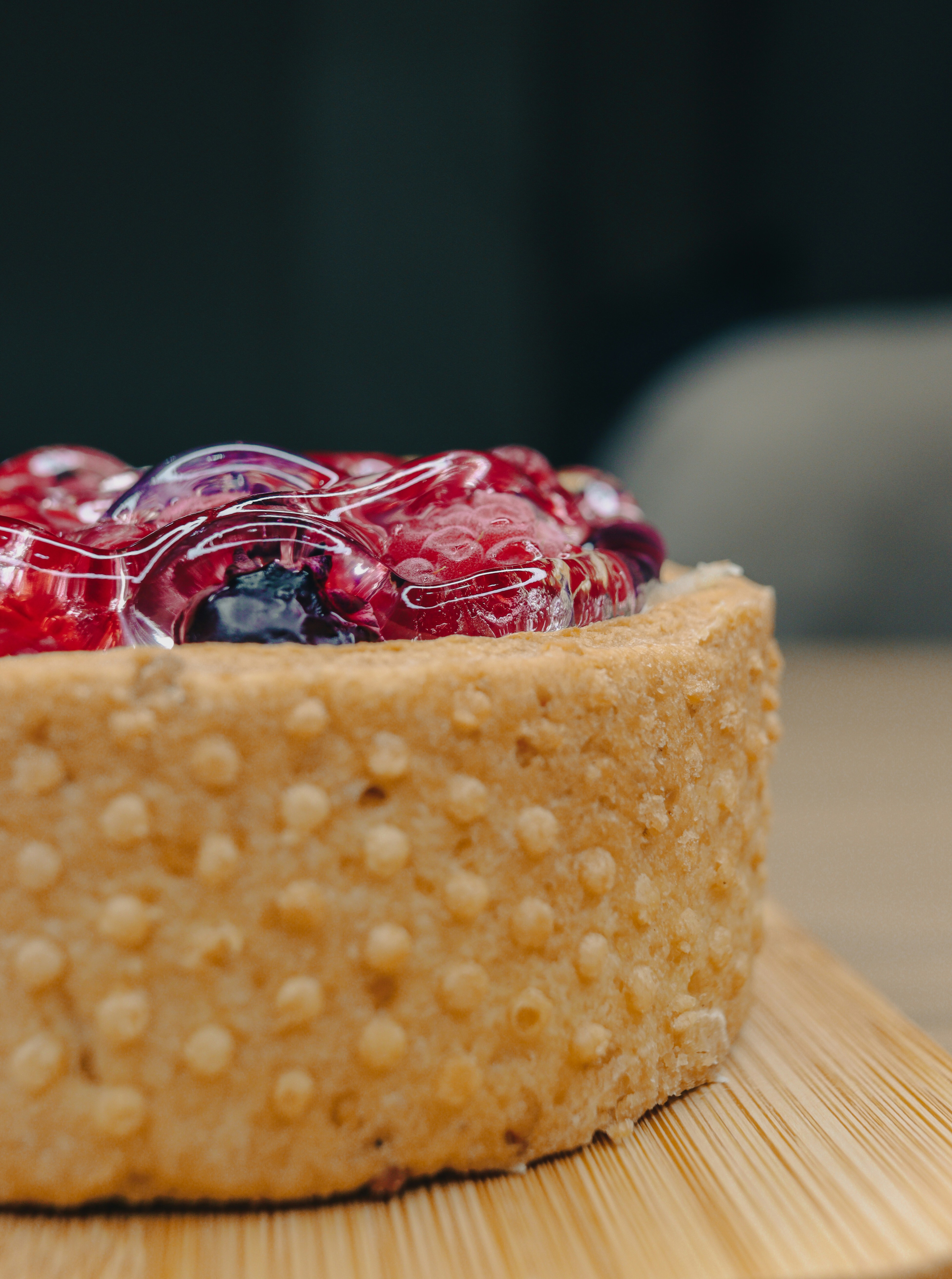 Jewel-Topped Tart: A Close-Up of Glazed Berries on Golden Crust
