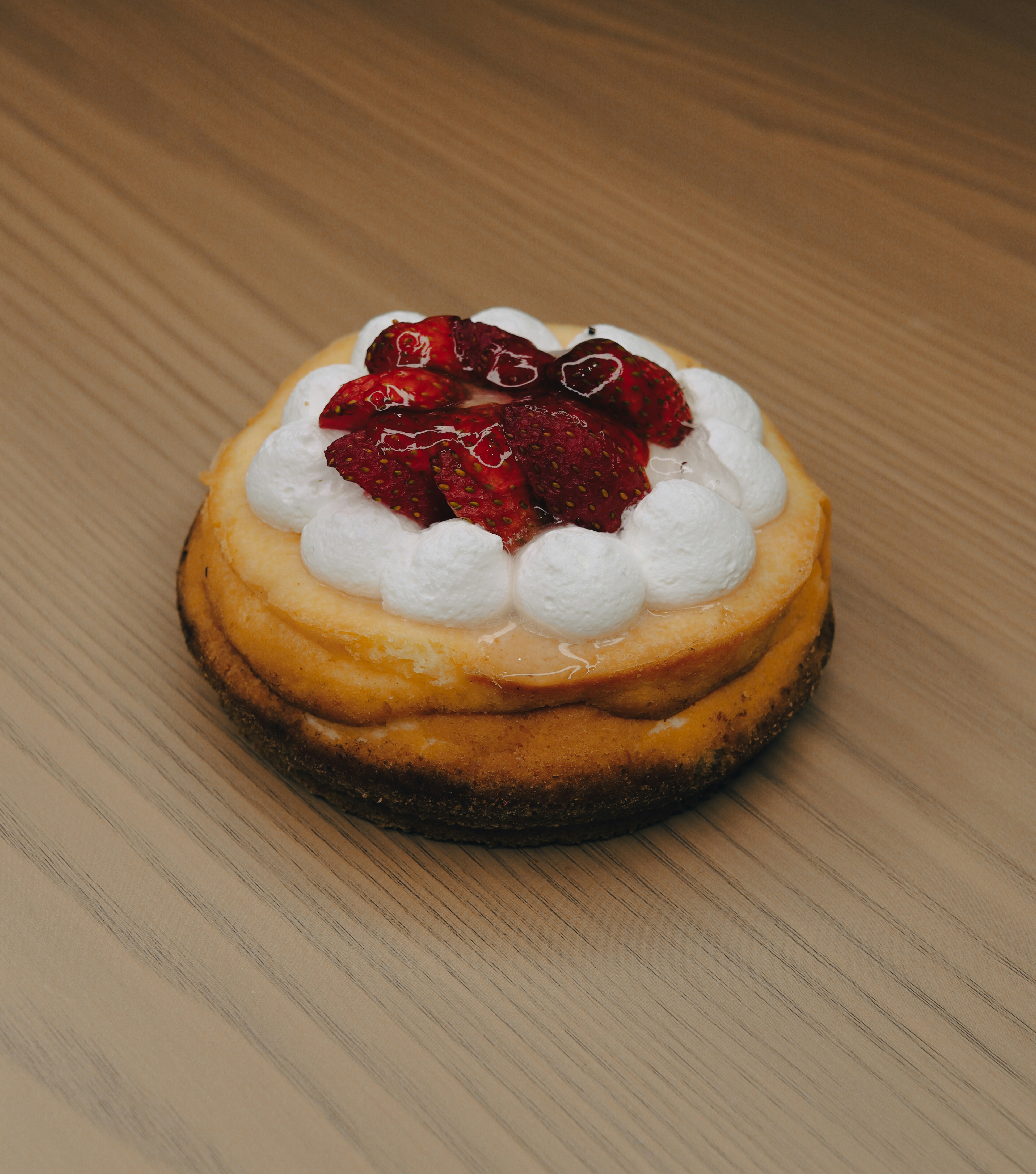 Strawberry-Top Tart on a Warm Wooden Stage