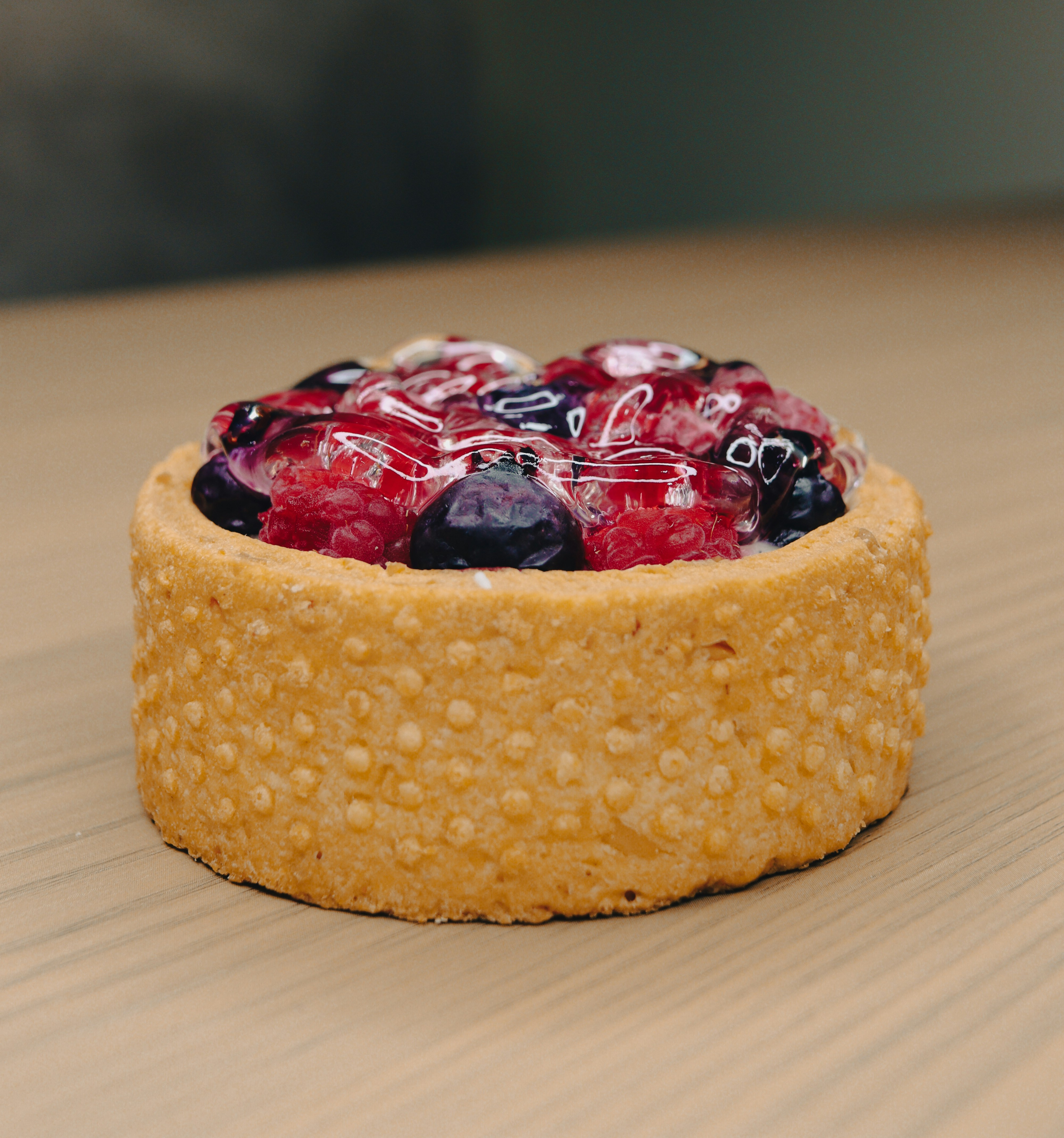 Golden Crust Berry Tart: glossy berries atop a simple wooden surface