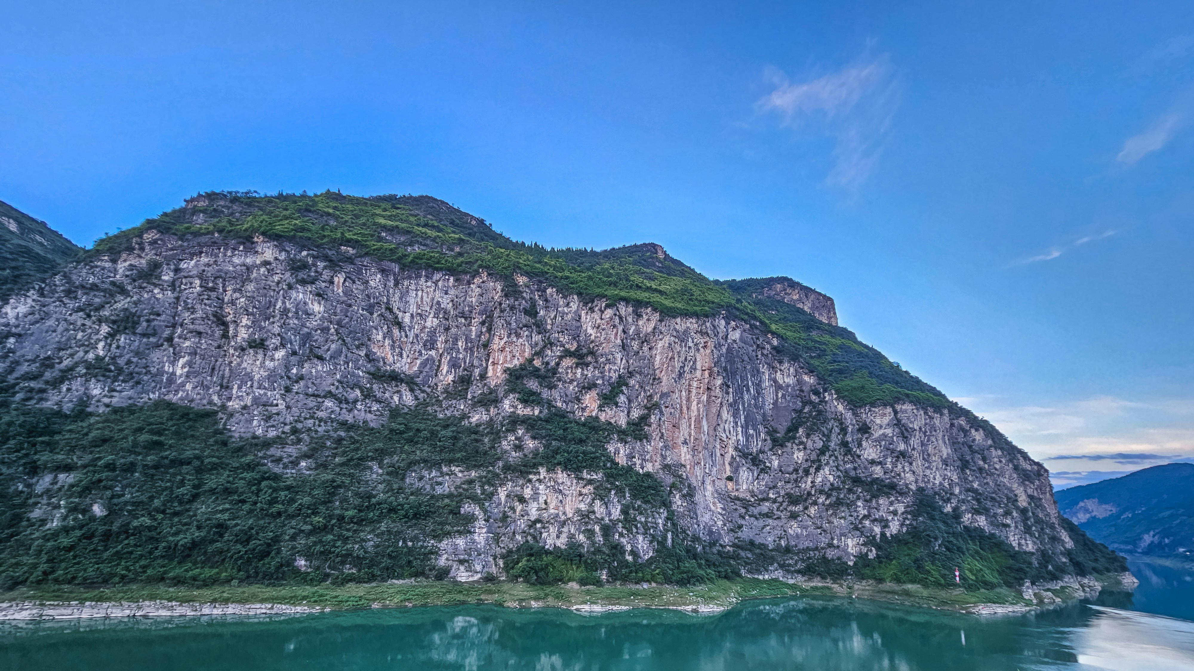 Verdant Cliffs Framing a Serene River Gorge