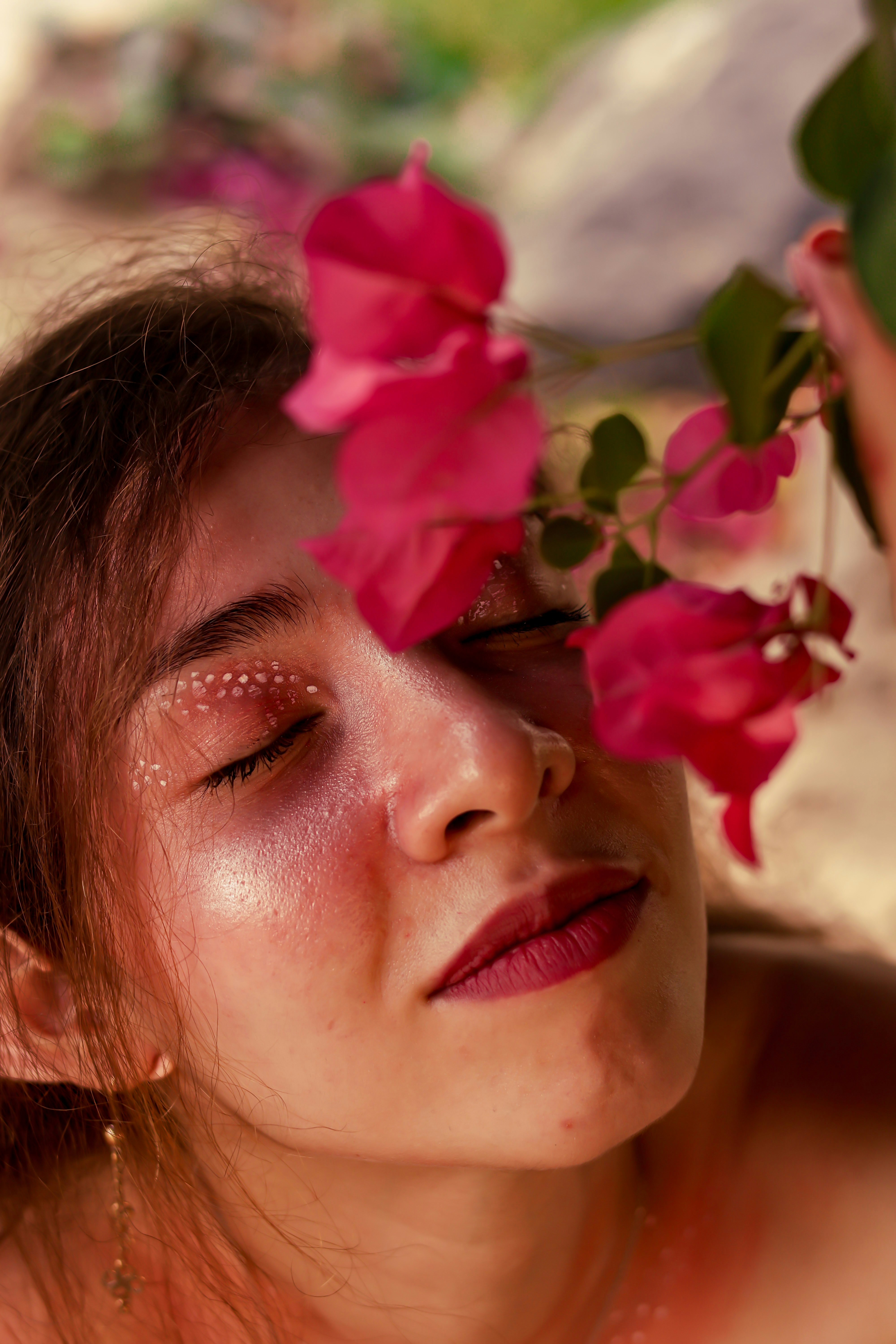Blossom Veil: a sunlit portrait framed by magenta petals
