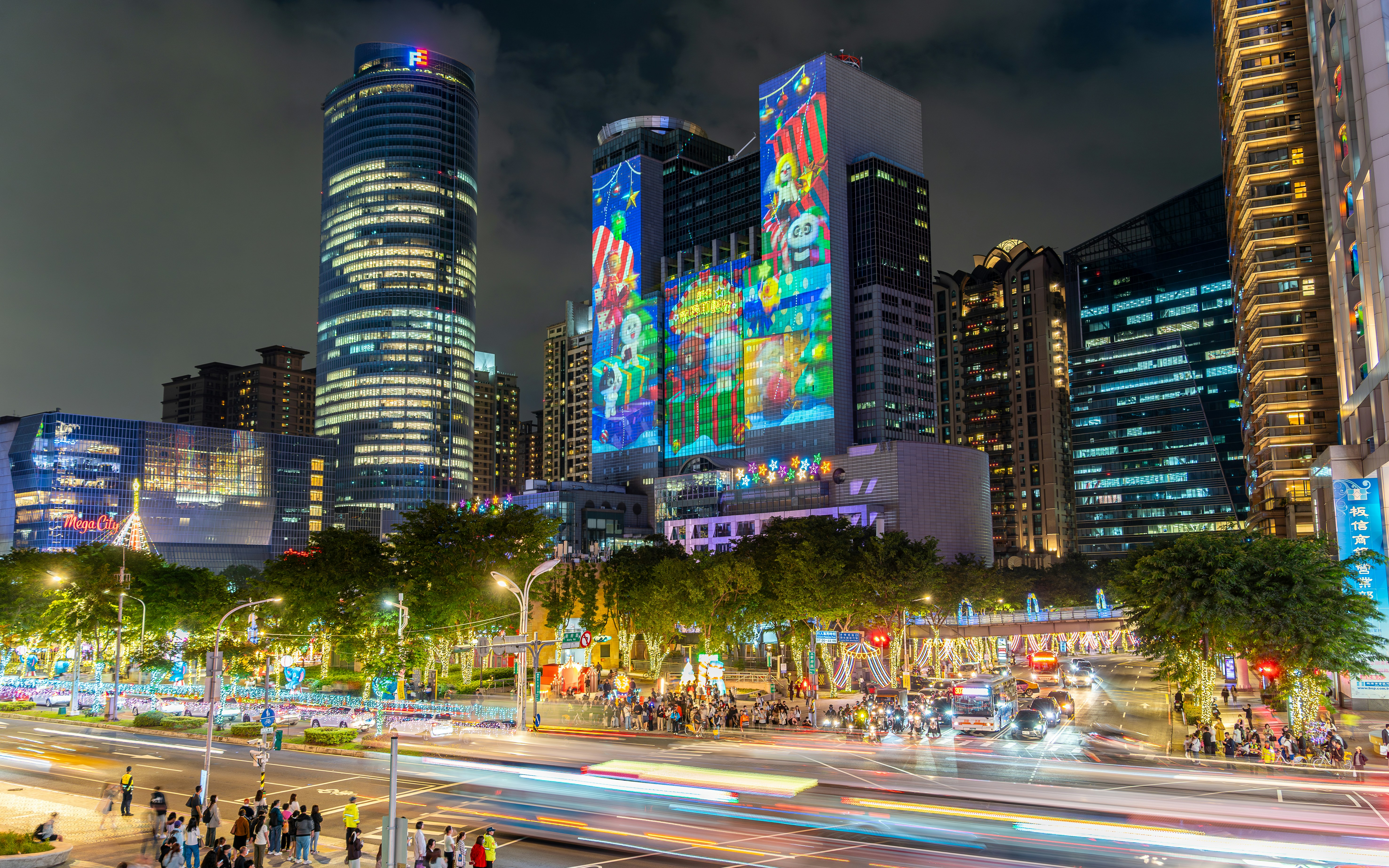 Midnight Mosaic: Neon Screens Over a Bustling City Street