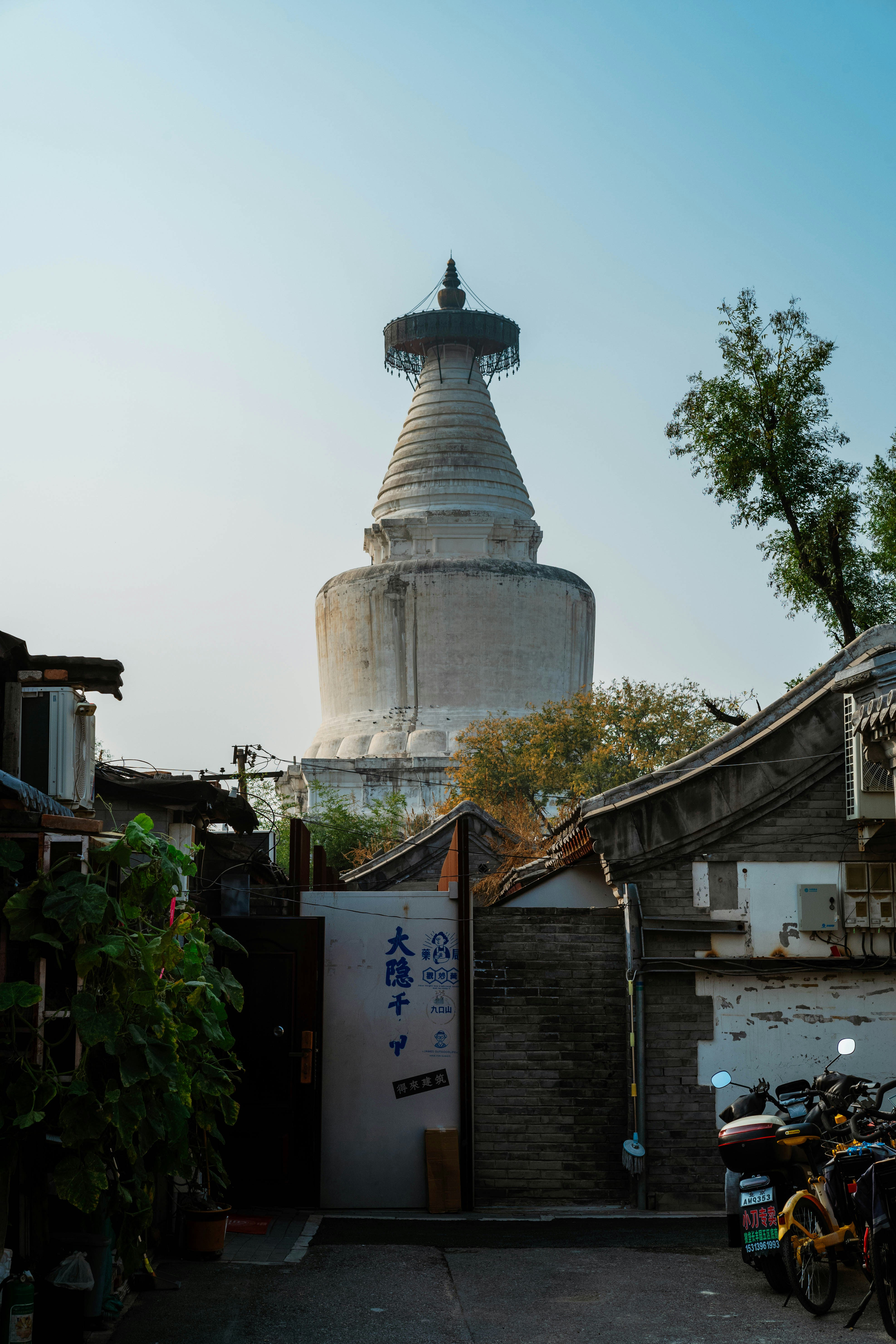 Stupa Over Rooftops: A White Beacon in Narrow Streets