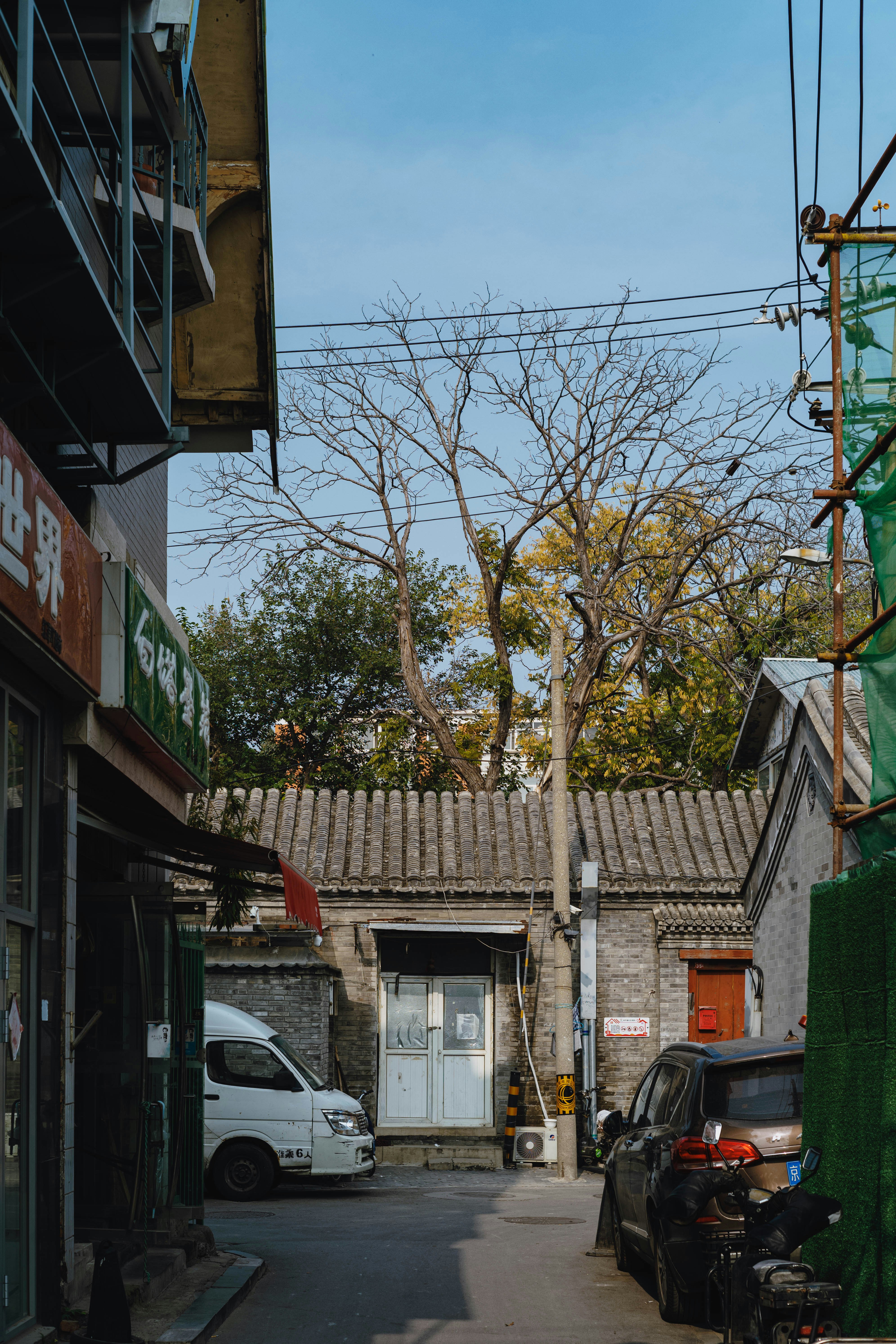 Gateway to a Timeless Courtyard: Alley Framed by Tile Roofs