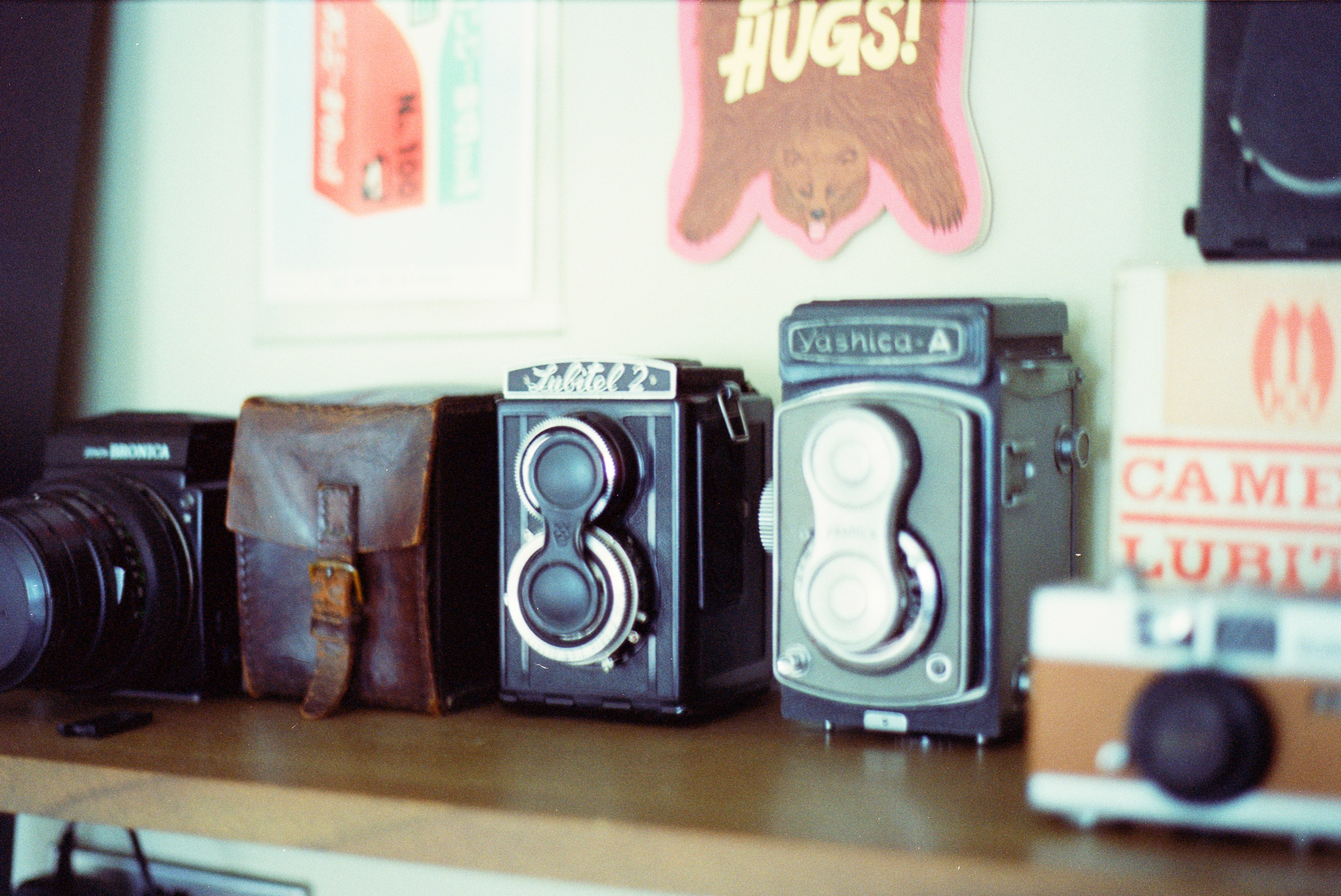 Shelf of Time: Vintage Twin-Lens Cameras and Leather Cases