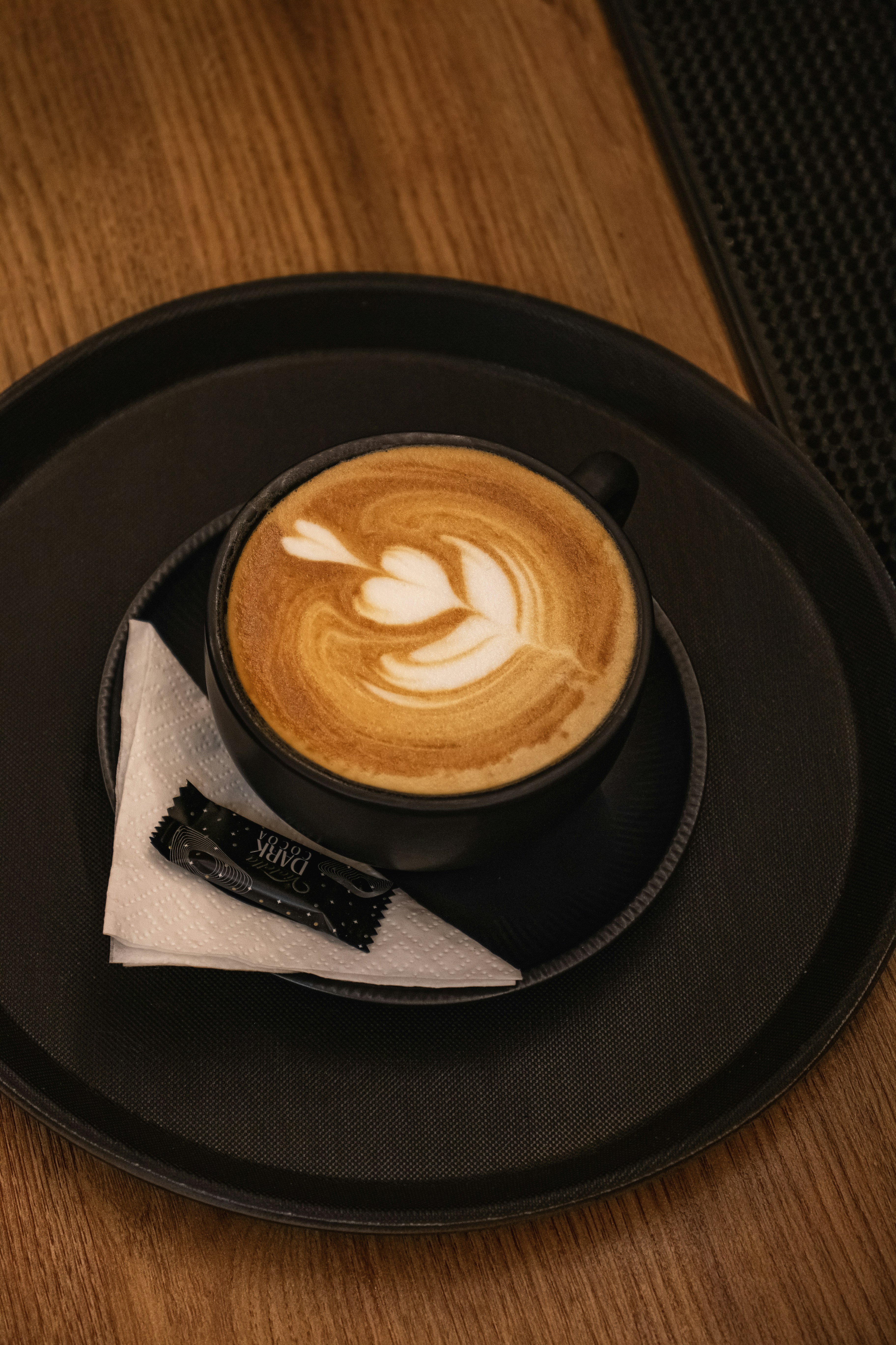 Latte Heart on a Dark Round Tray: Minimal Café Moment