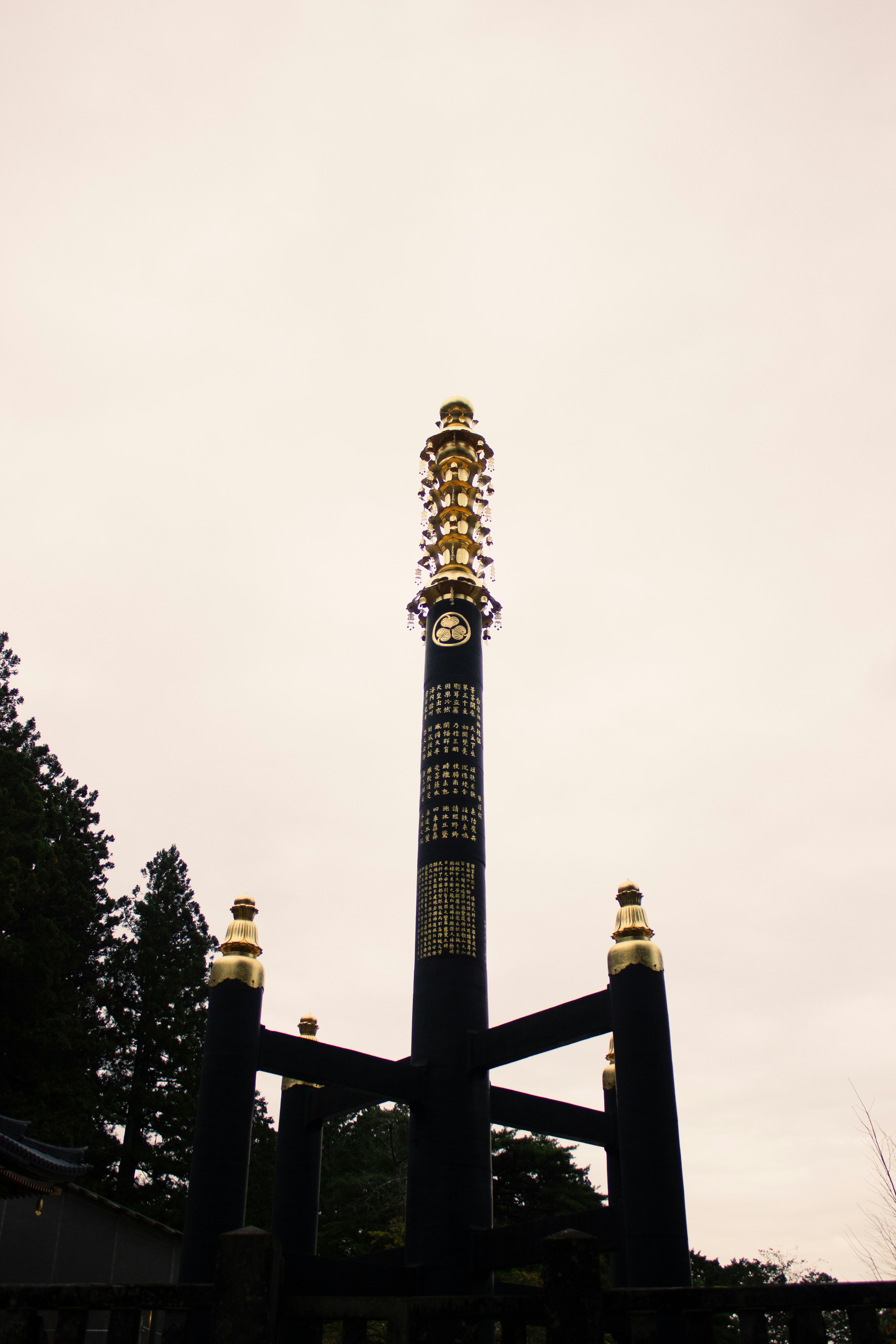 Gold-Crowned Monolith Rising in a Quiet Park