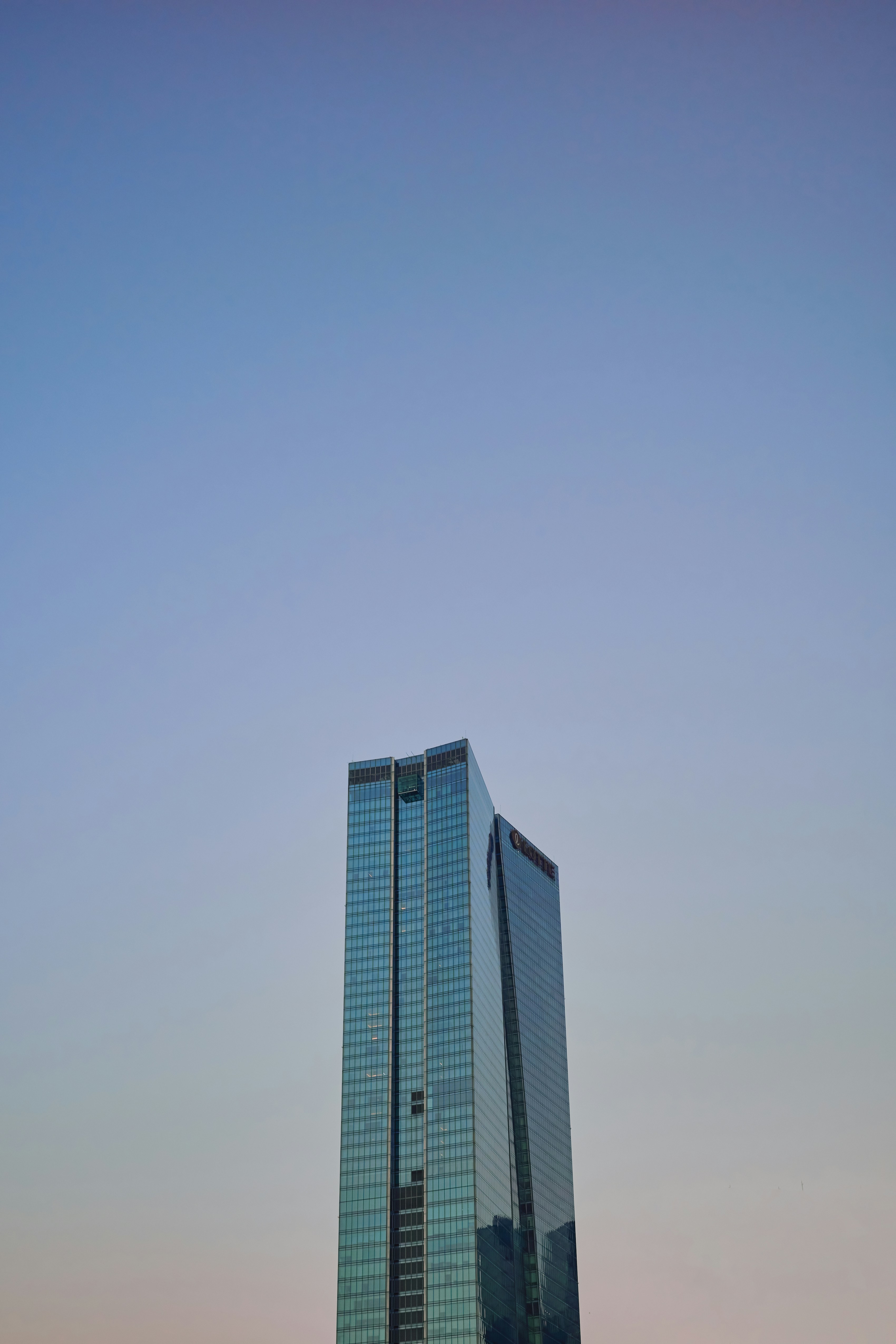 Pastel Sky Over a Modern Glass Skyscraper