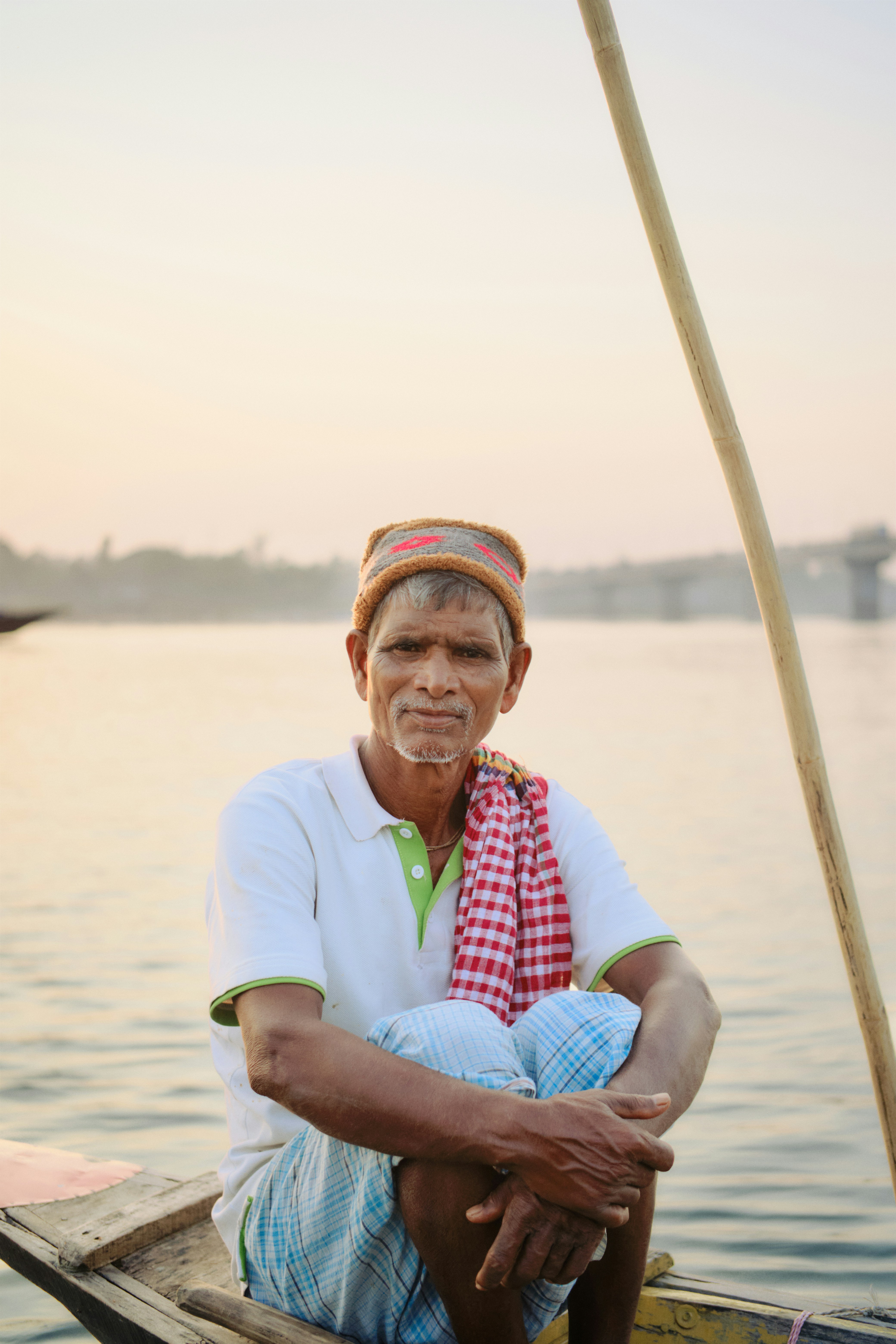 Sunset Portrait on the River: A Boatsman's Quiet Corner