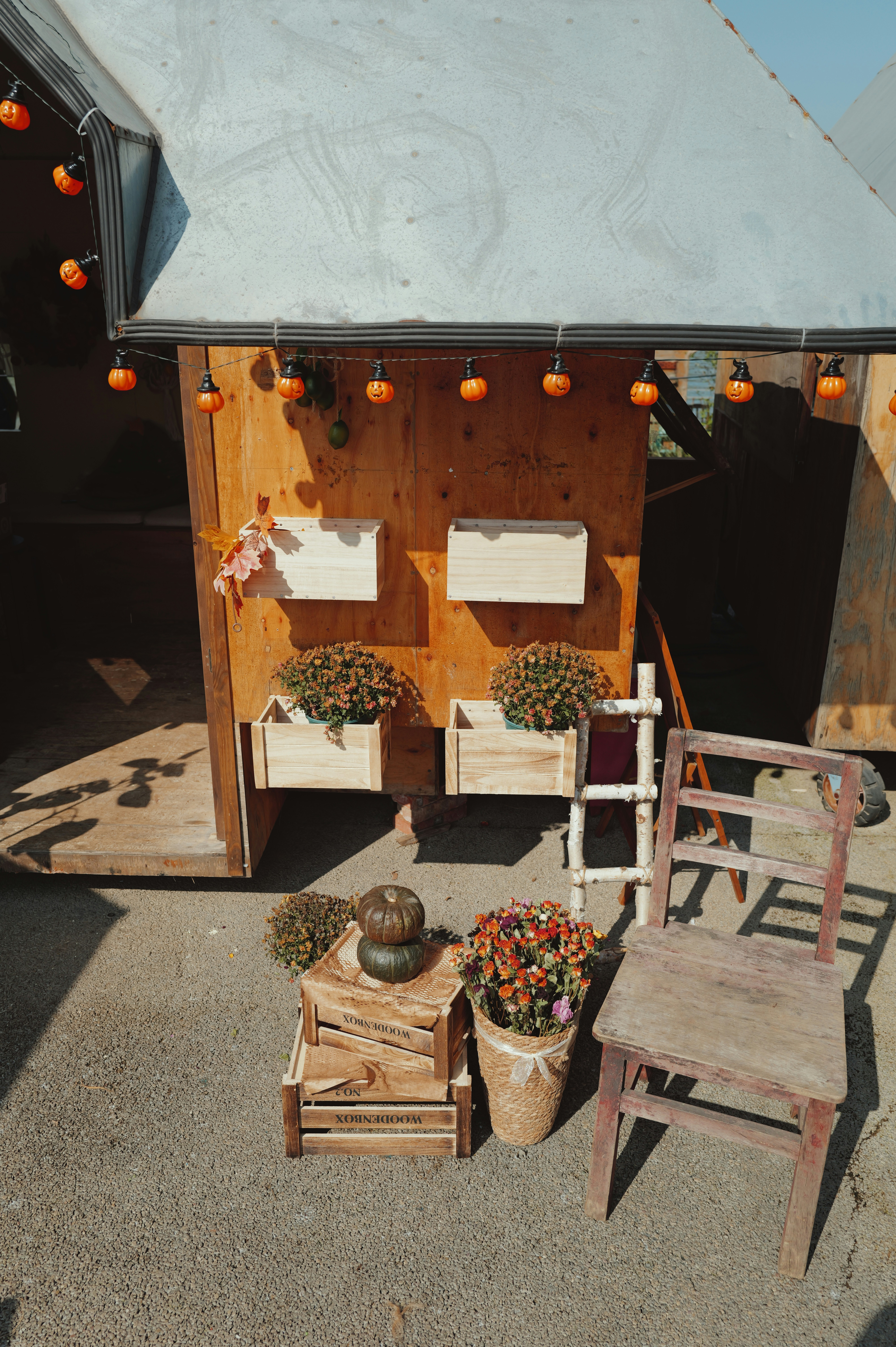 Lantern-Lit Rustic Market Facade: Crates, Stairs, and Blooms