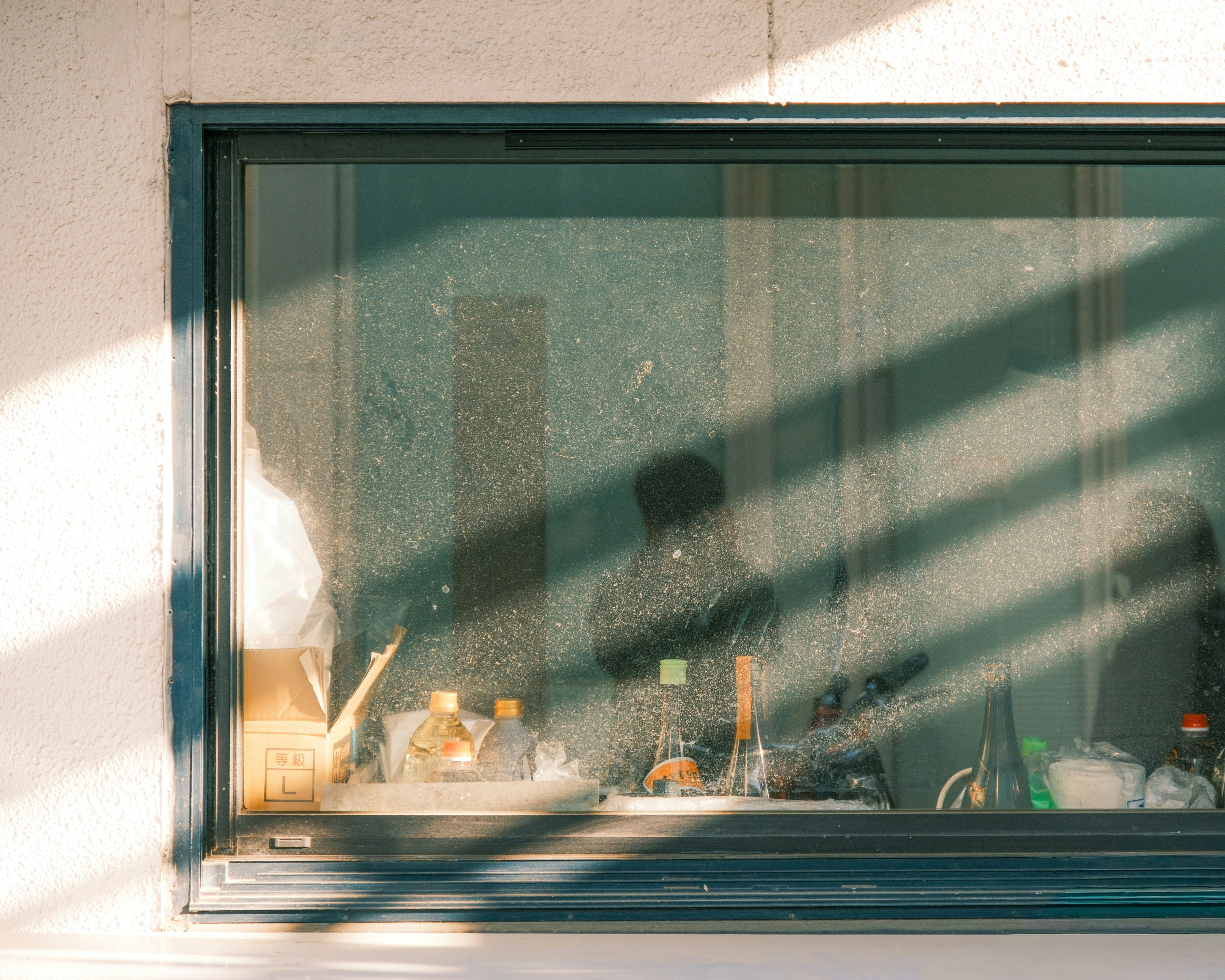 Sunlight streams through a window onto a cluttered sill. photo – Free ...