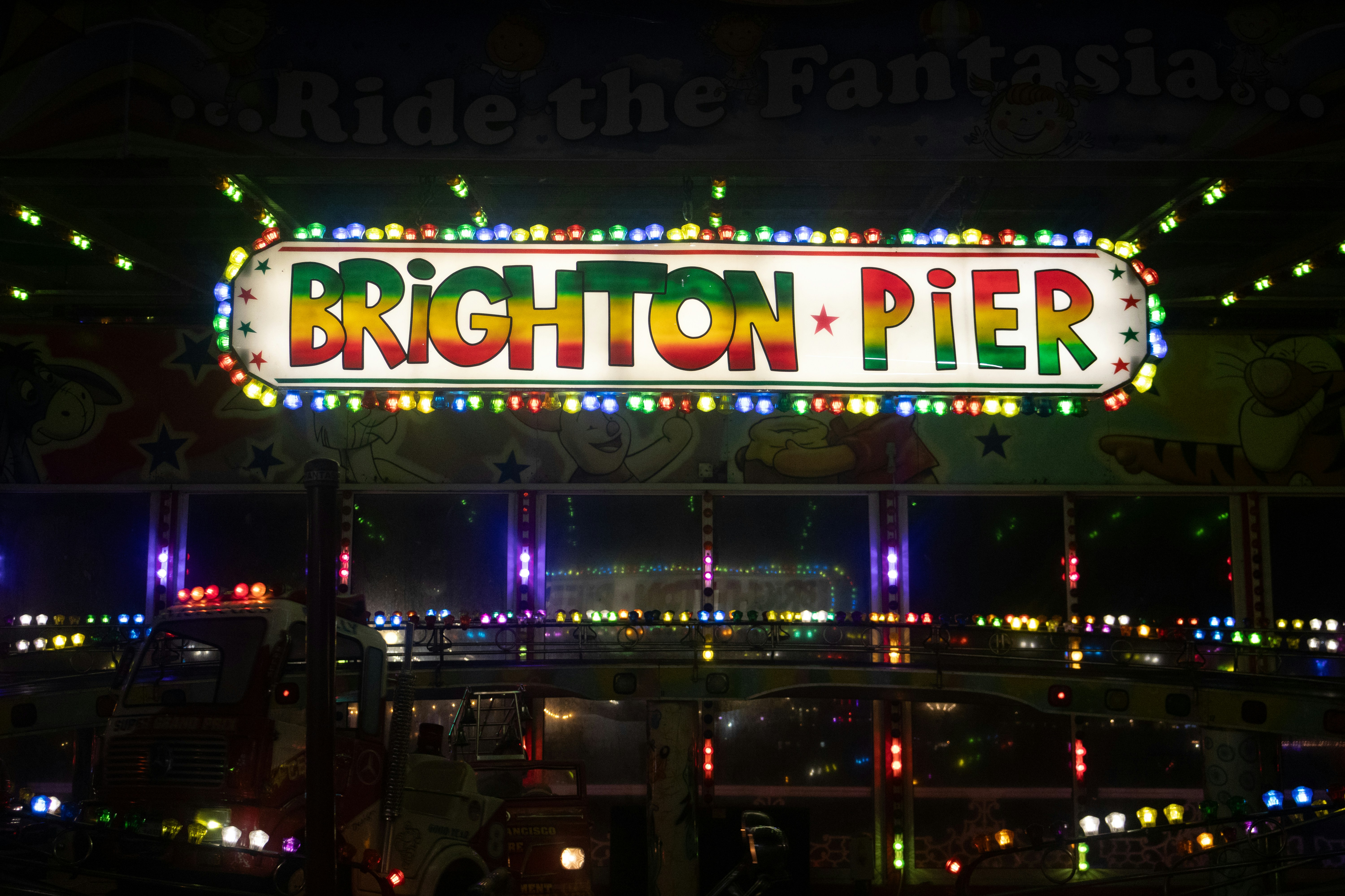Neon Crown Over Brighton Pier: Night Carnival Lights
