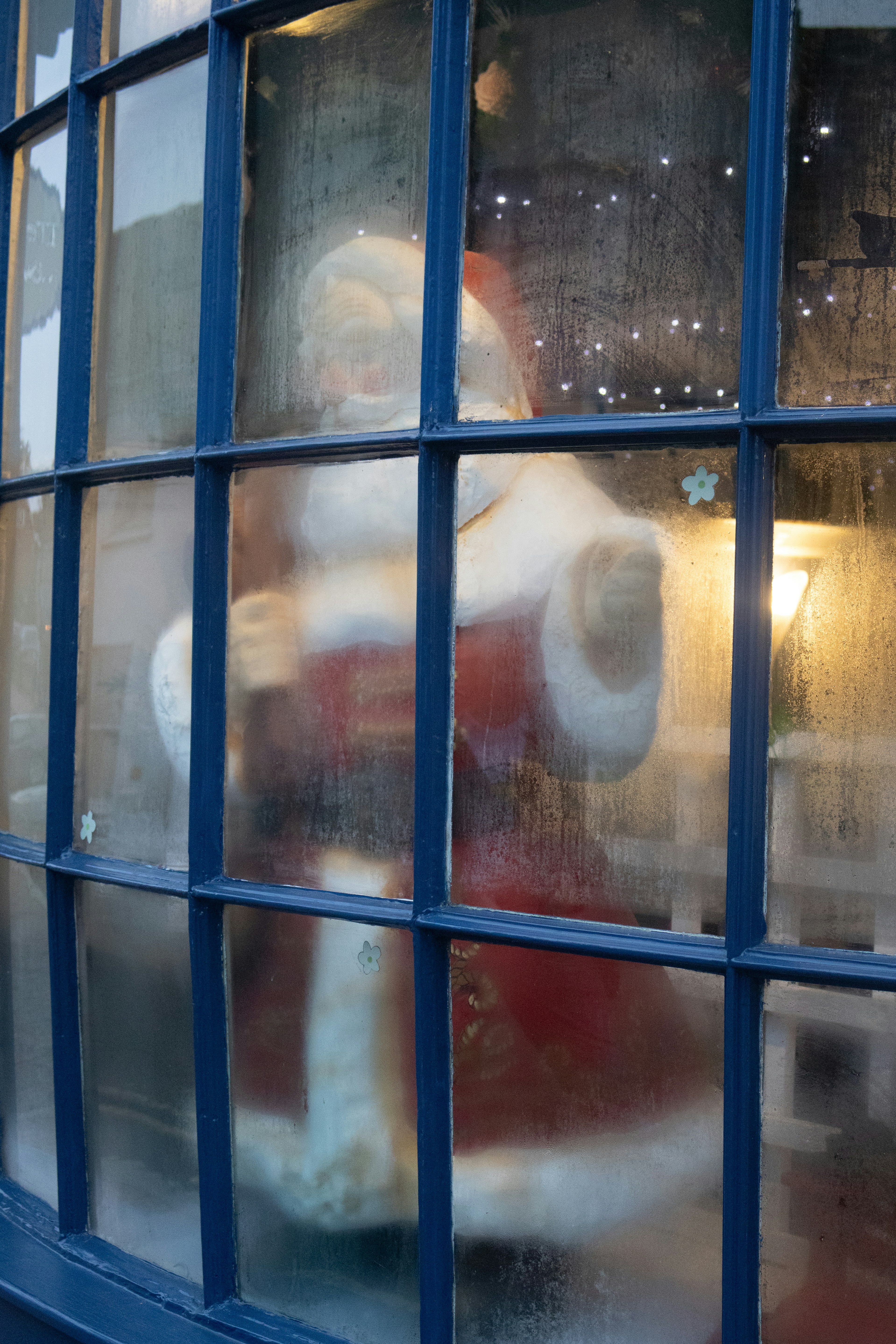 Blue-Framed Santa Behind Frosted Glass