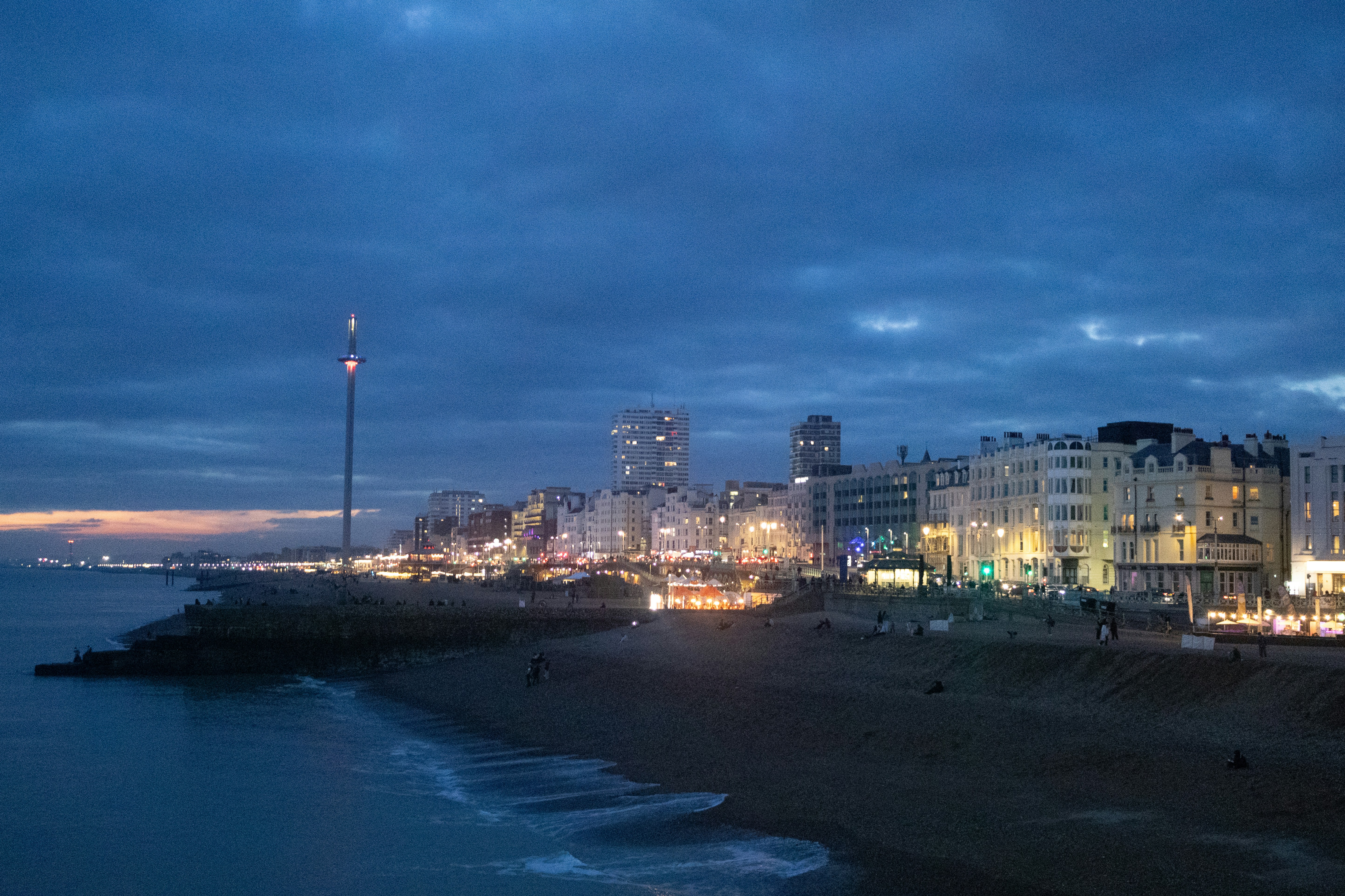 Blue Hour Promenade: Neon Reflections on a Seaside Skyline