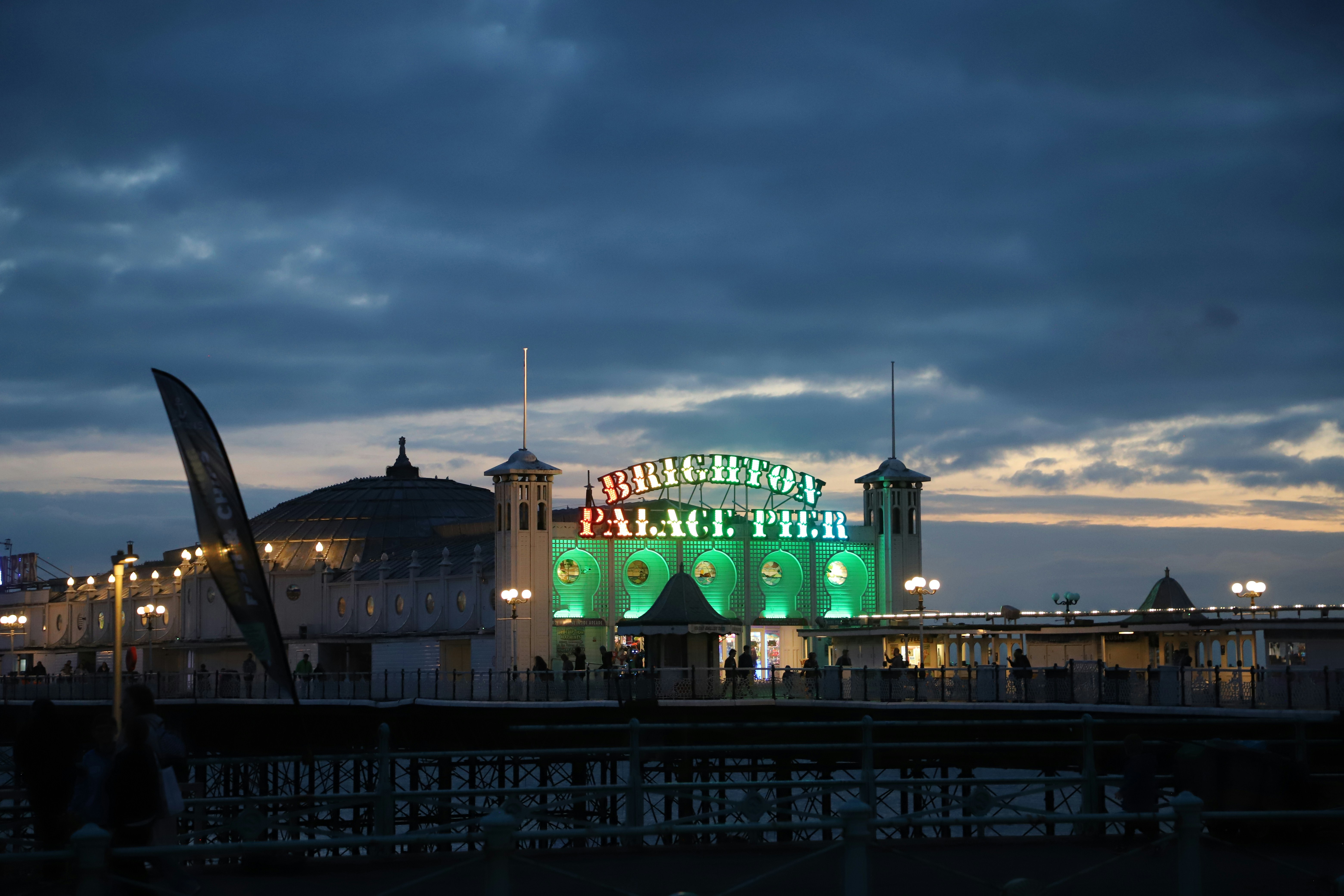 Green Neon Crown Over Brighton Pier at Dusk