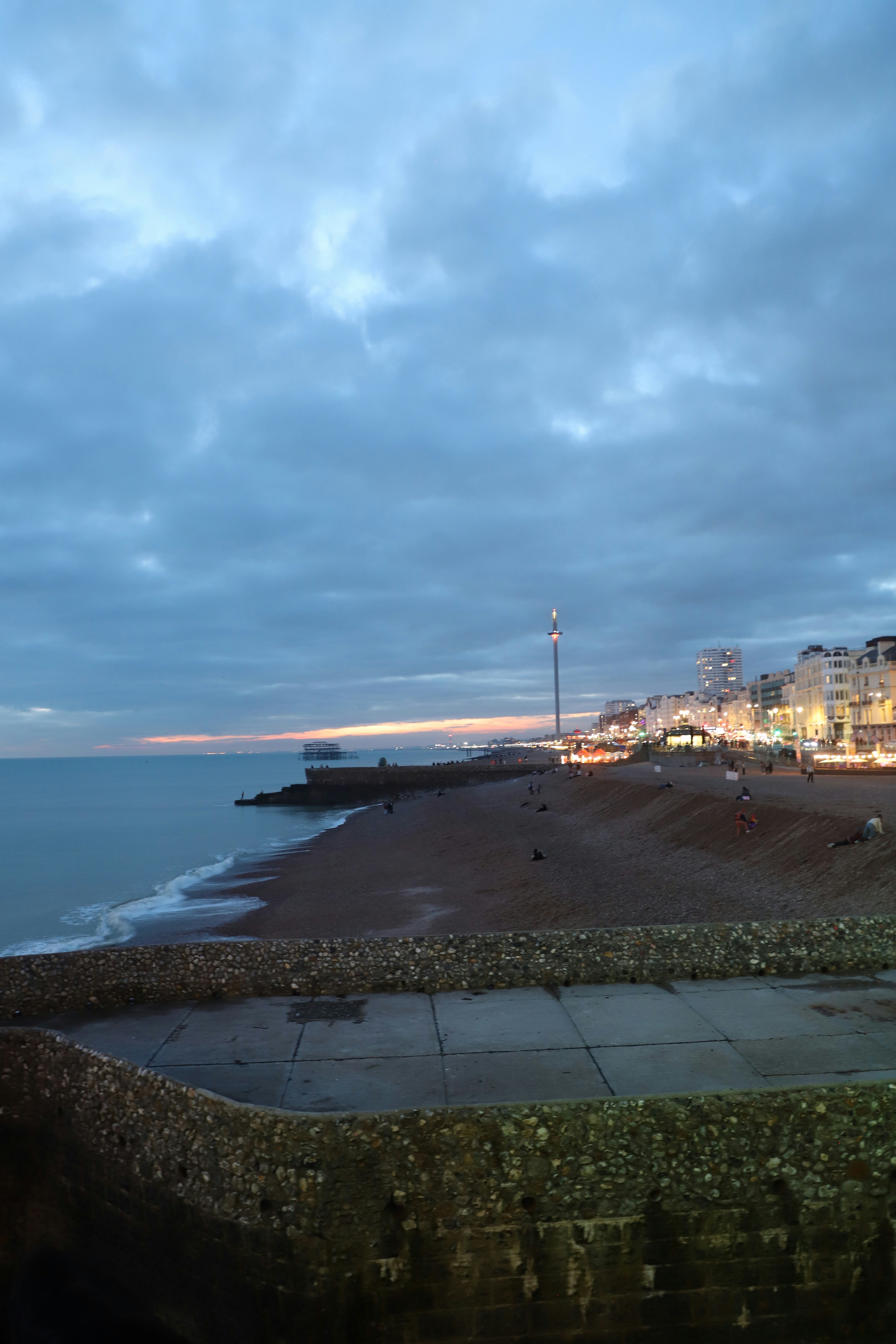 Dusk Along the Promenade: Neon Light Meets Cloud-Kissed Coast