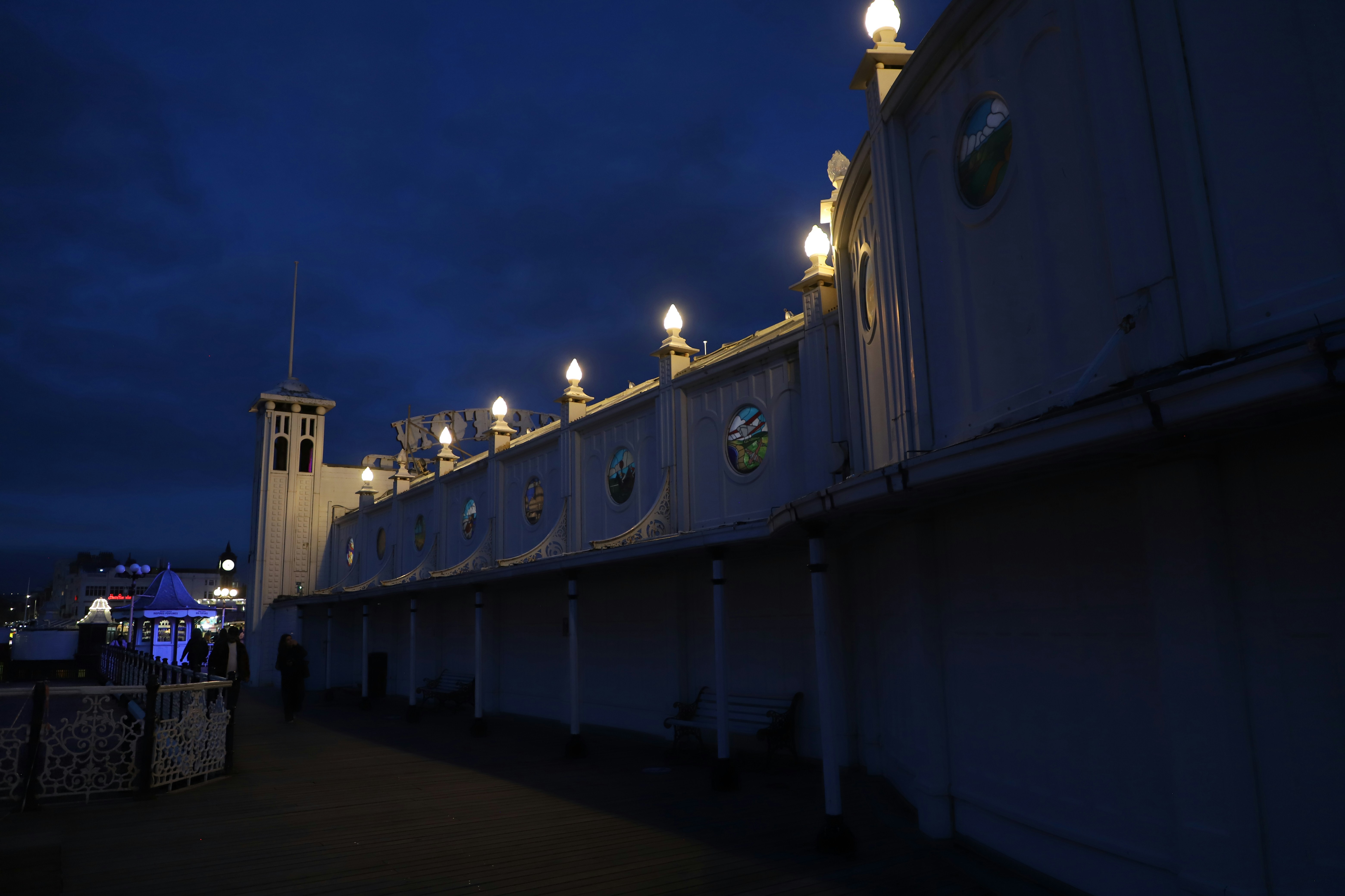 Blue Hour Promenade: Luminous Railings Guide a Quiet Night Walk