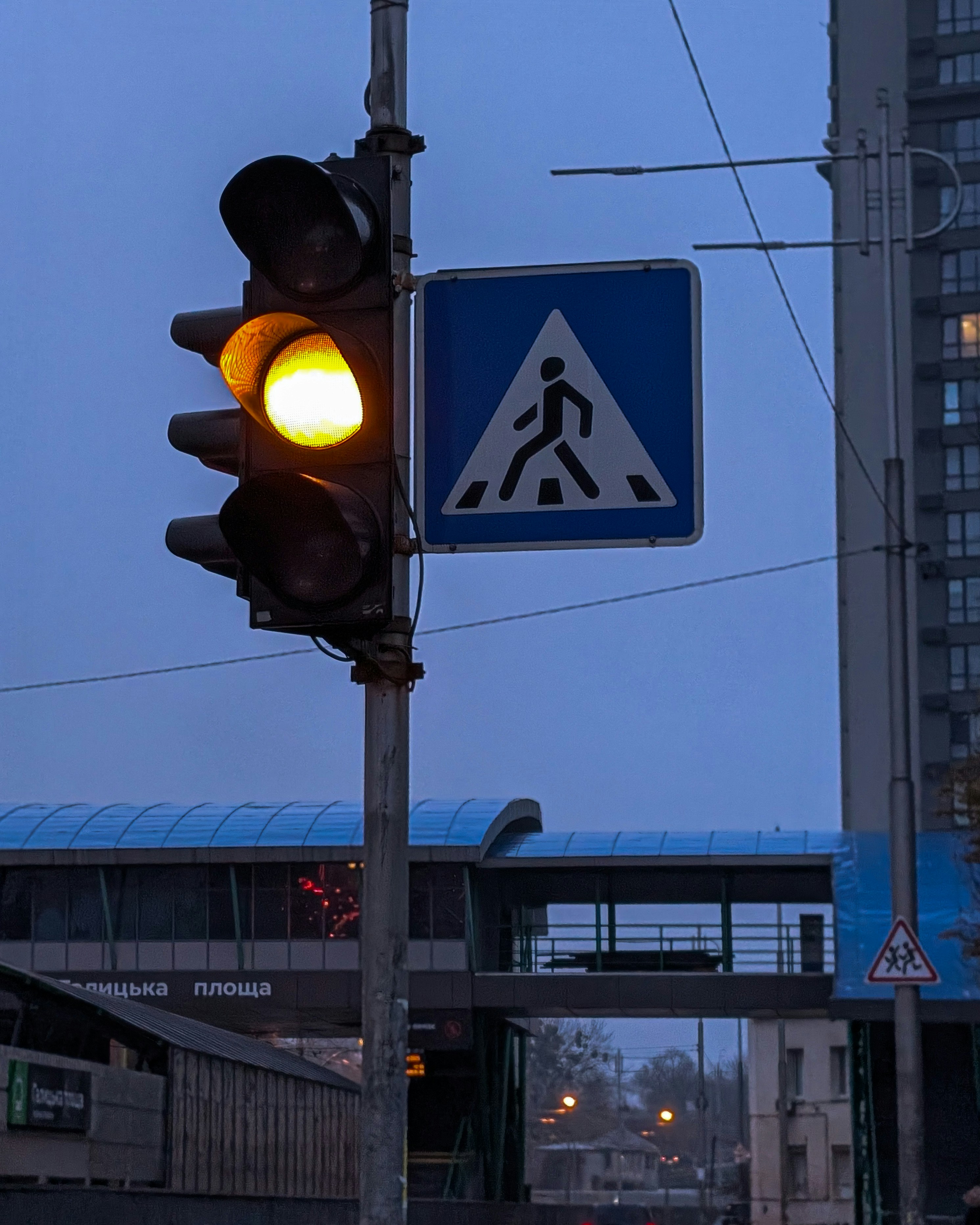 Yellow Pedestrian Signal Illuminates a Blue Hour Crossing