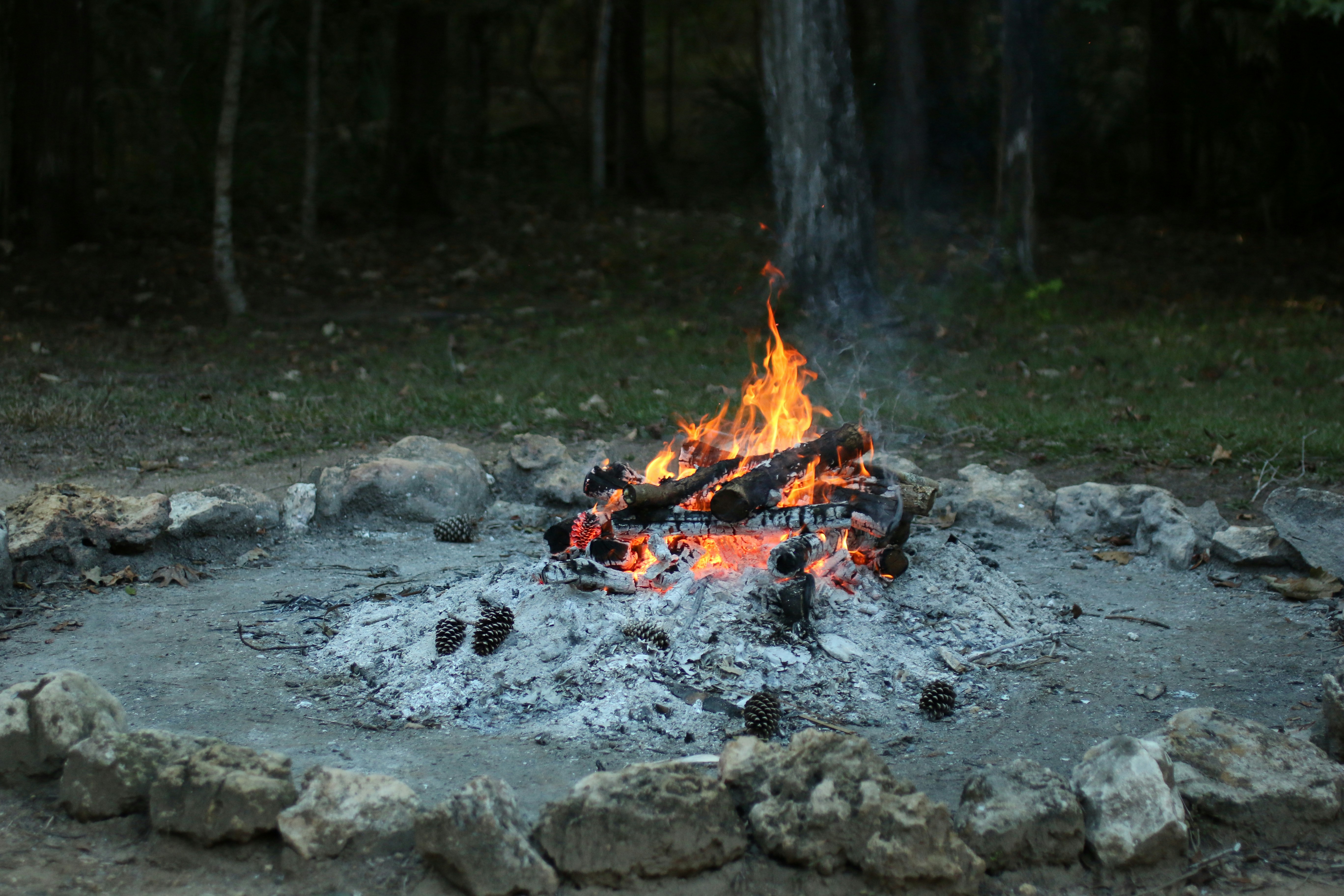 Bonfire set with a safe isolating ring of rocks.