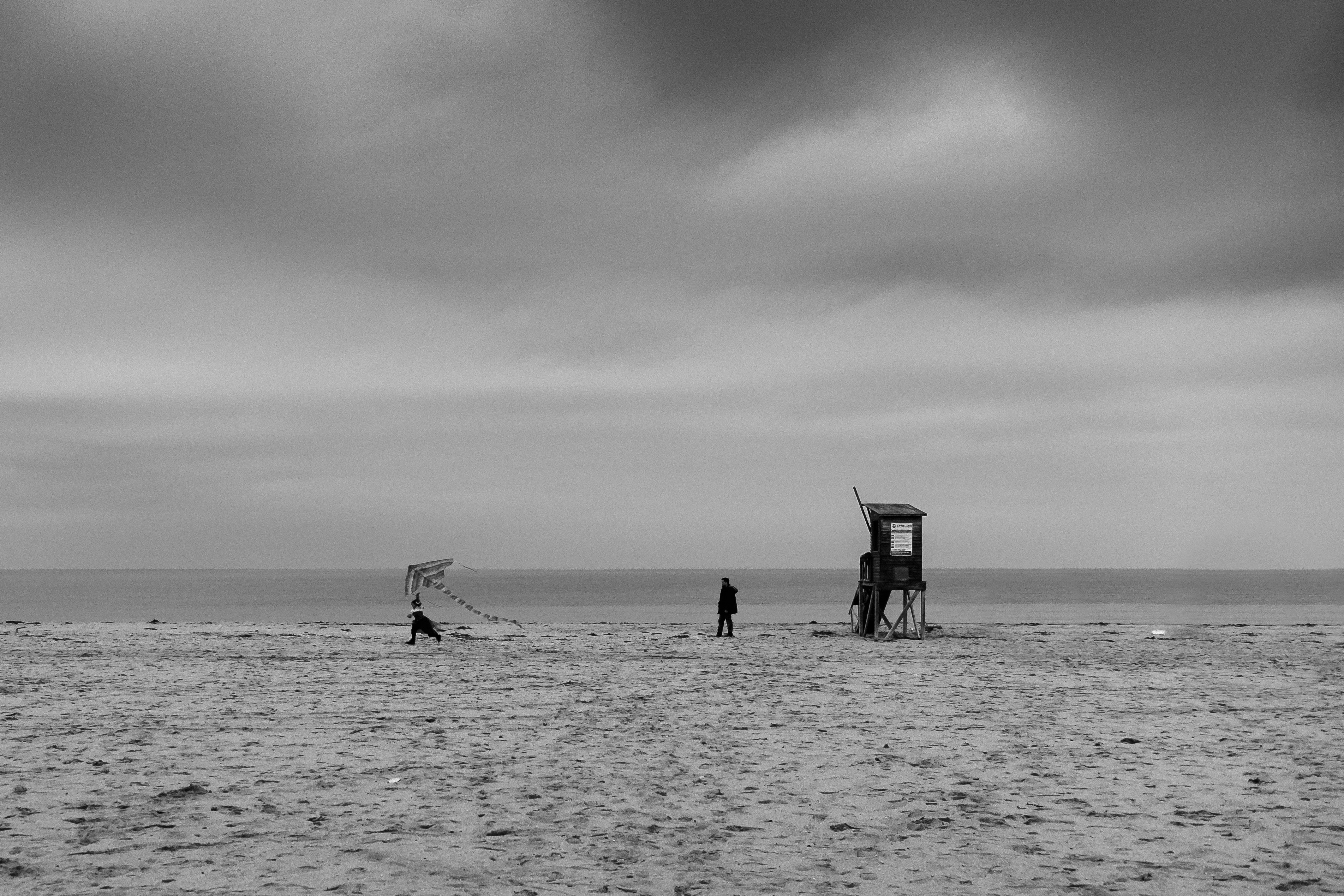 Grey Tide Sentinel: Lifeguard Tower at the Distant Horizon