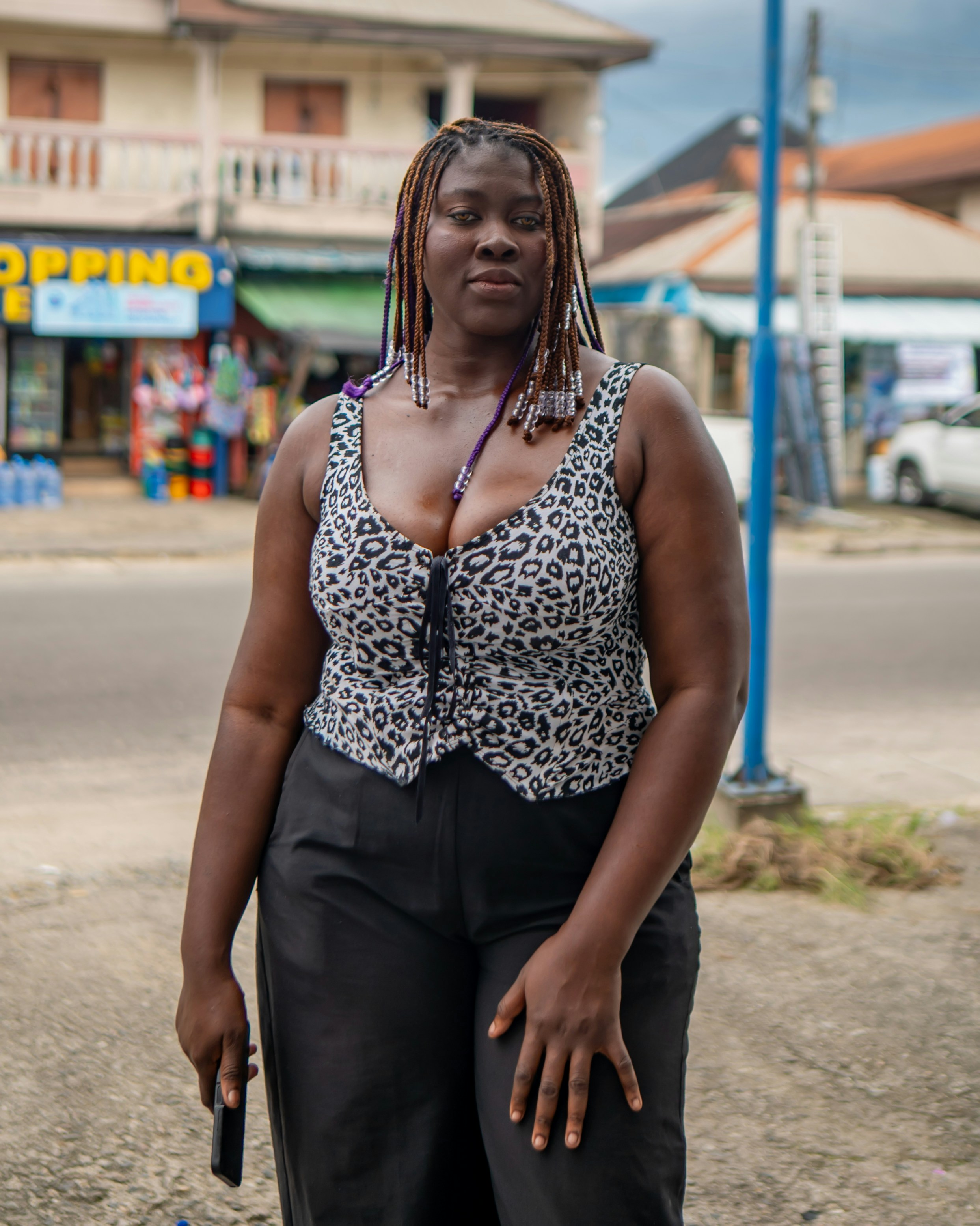 Leopard-Print Portrait Amid a Busy Street Scene