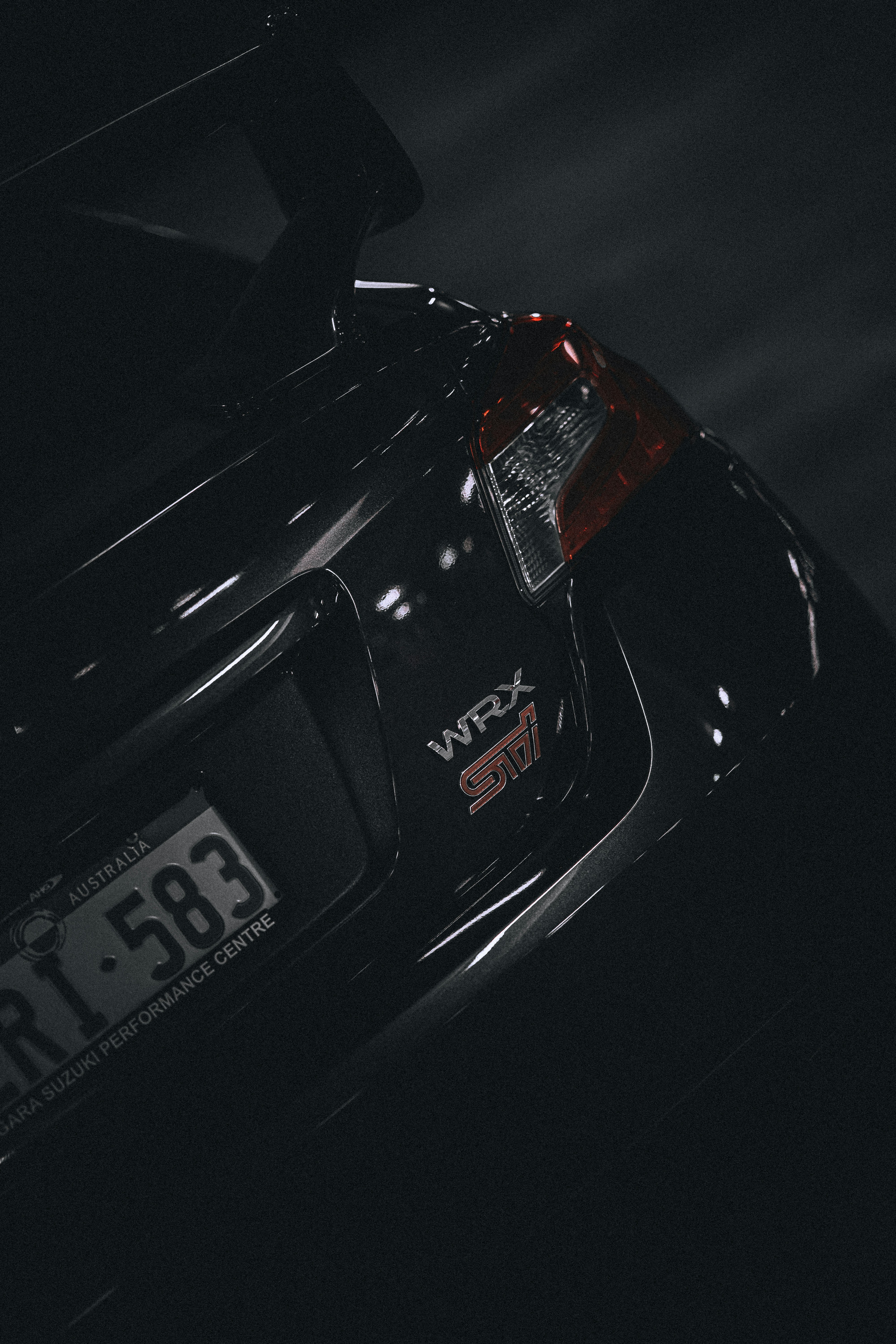 Night-Glinted Edge: The WRX STI Emblem in Velvet Shadow