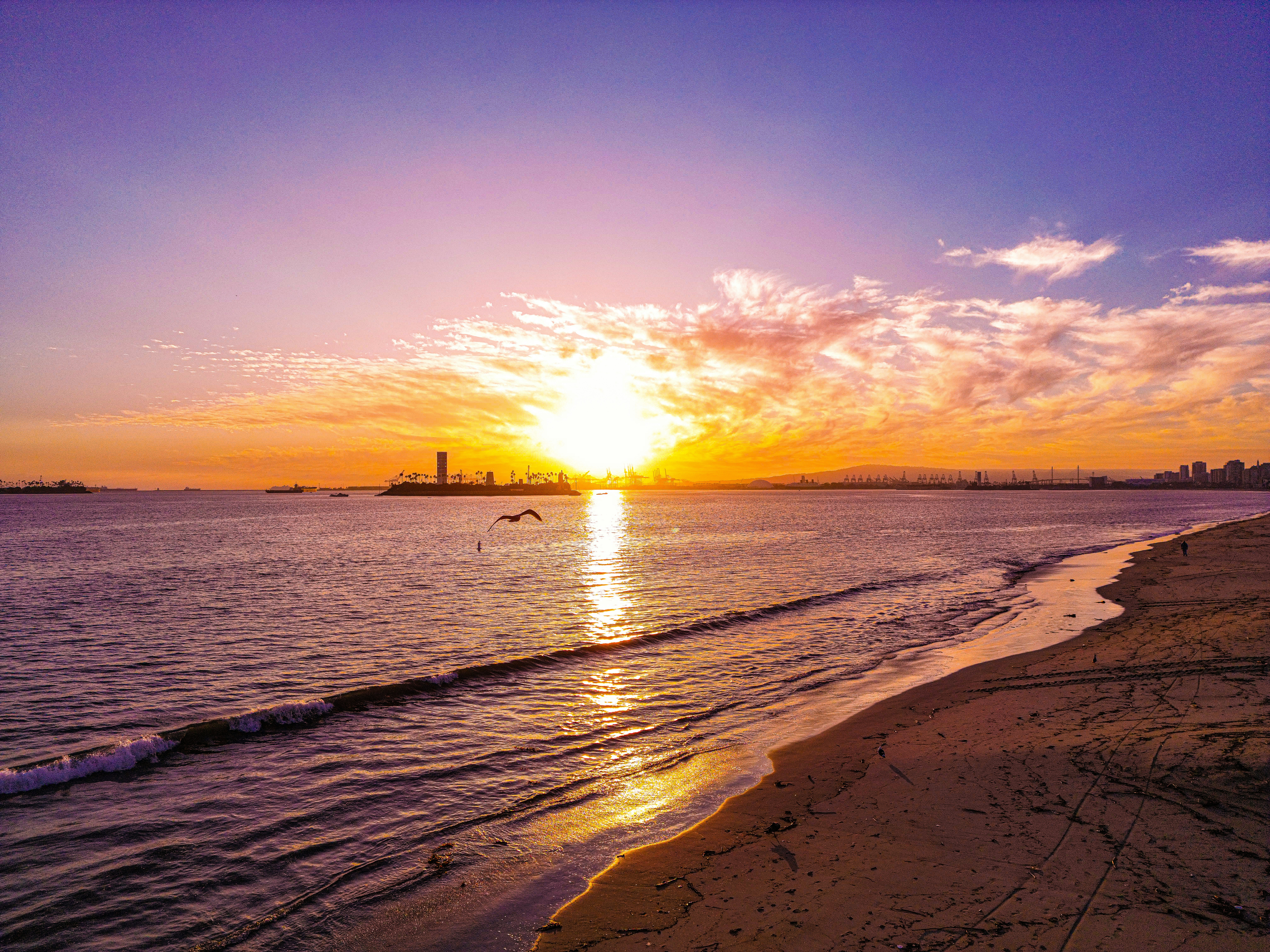 Ember Horizon over a Quiet Seaside City