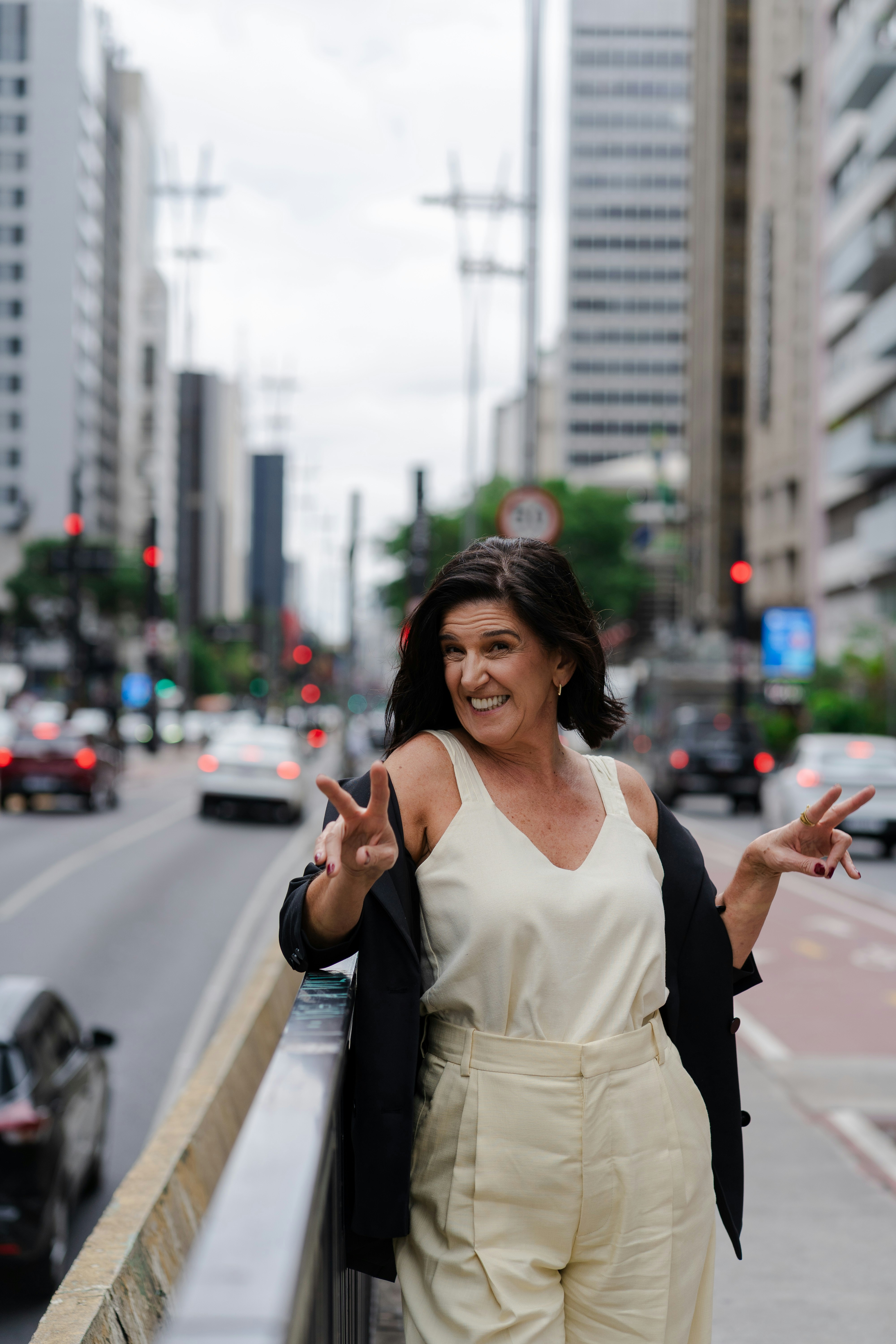Crosswalk Confidence: Cream-suited figure centers a bustling city street
