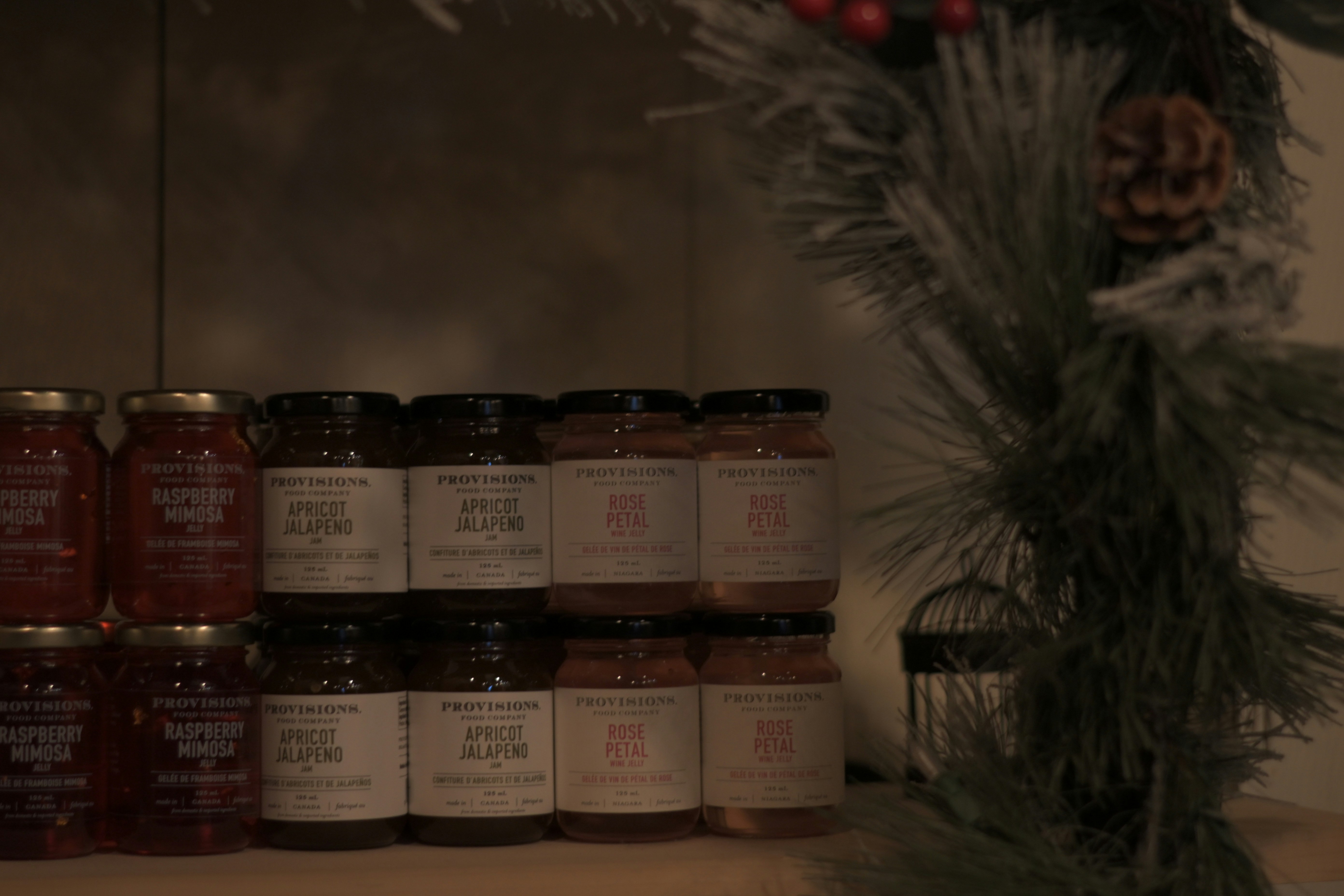 Quiet Pantry Row: Glass Jars Bathed in Warm Shadow