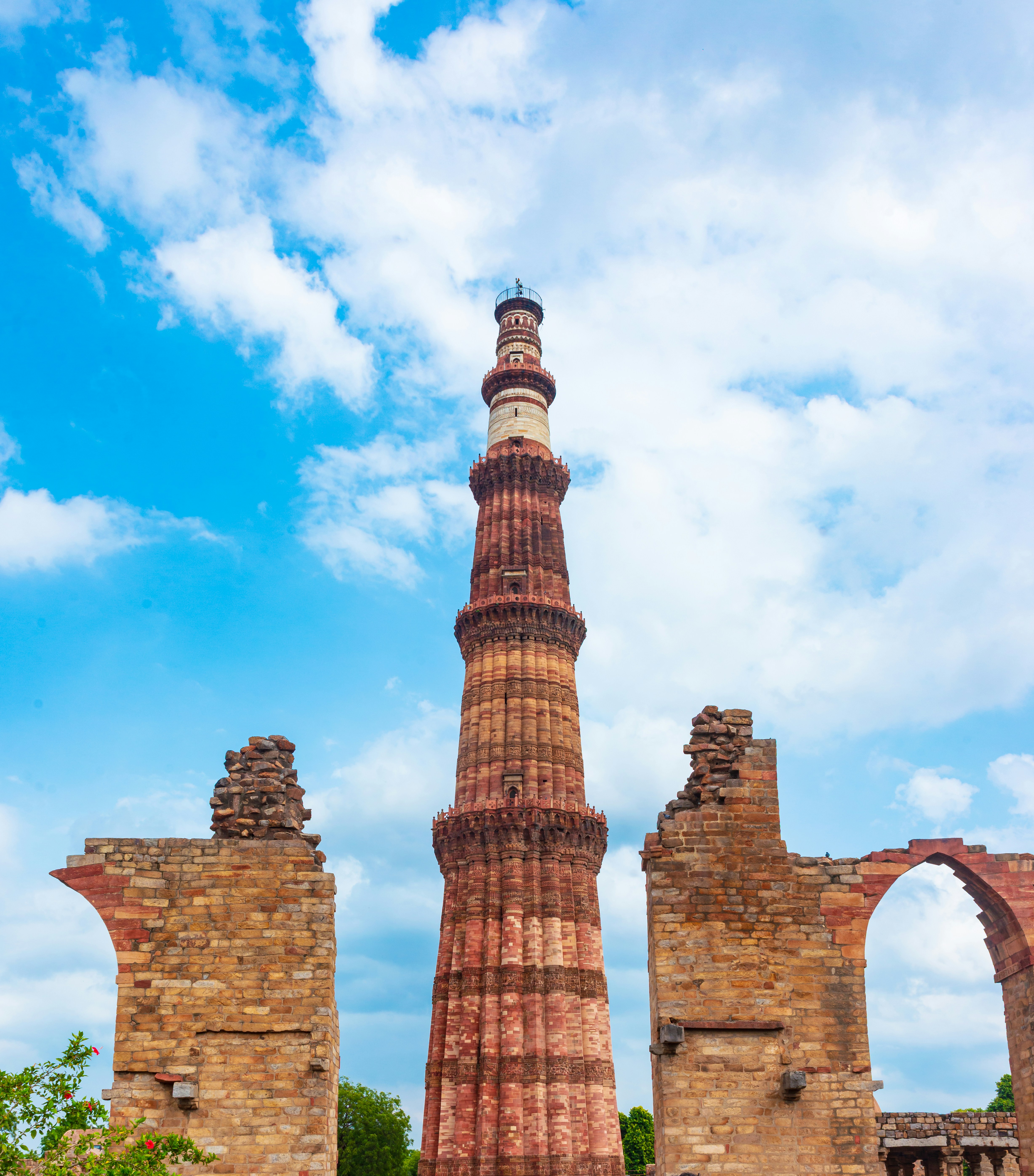 The Lone Minaret Rising Above Ruins Under a Sky of Blue