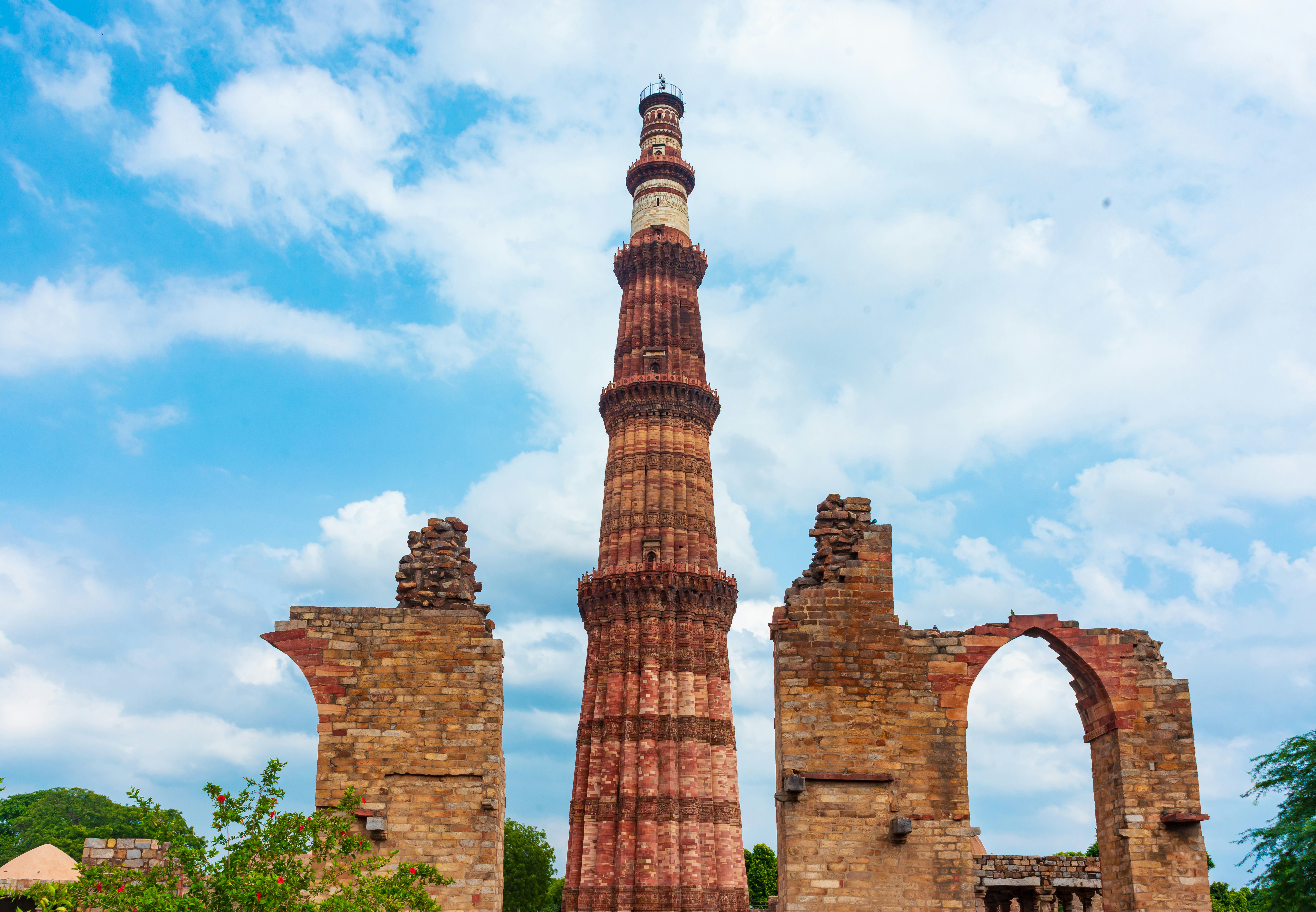 Brickspire Between Ruins: A Minaret Rising Between Timeworn Arches