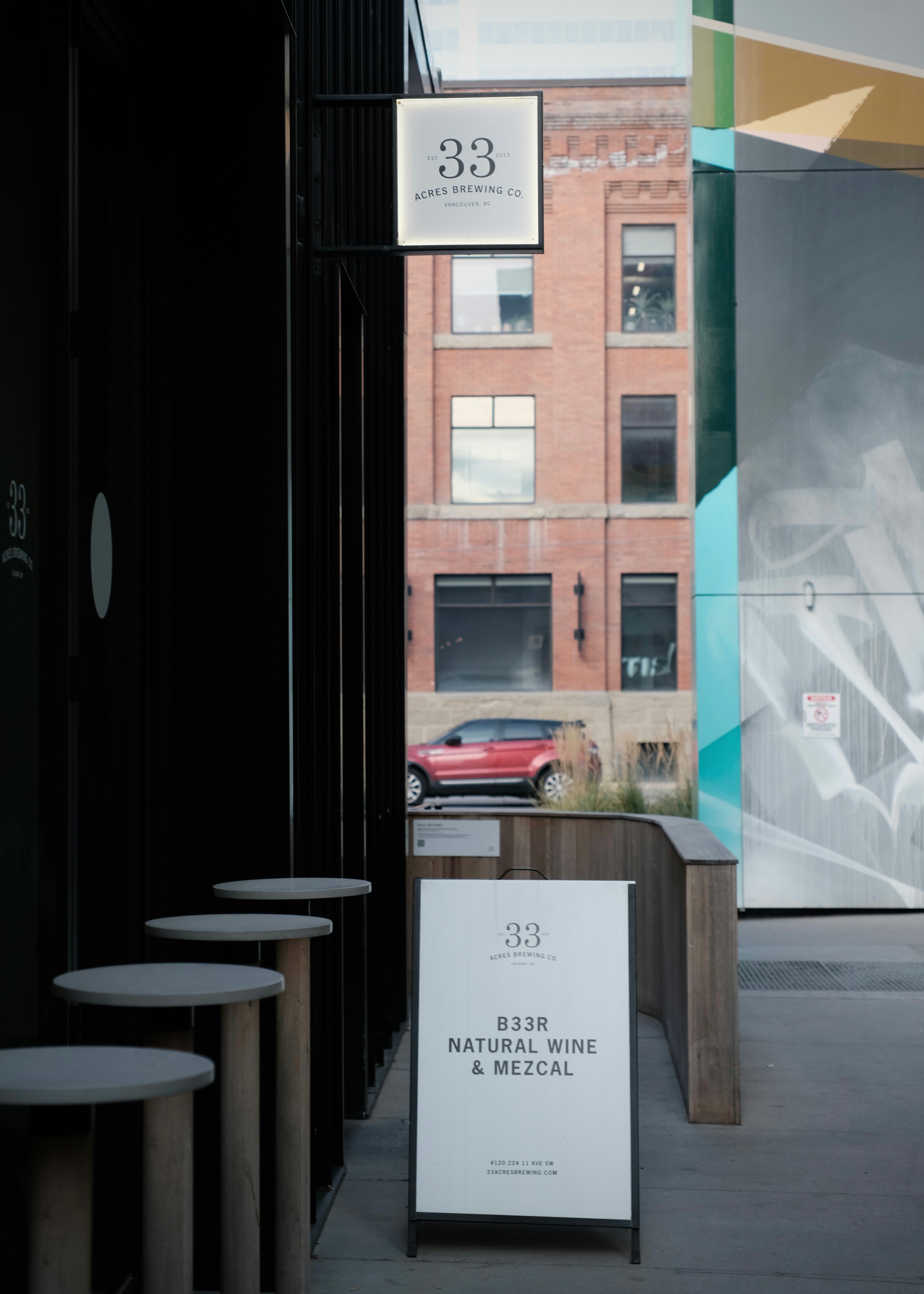 A sign for 33w natural wine & mezcal