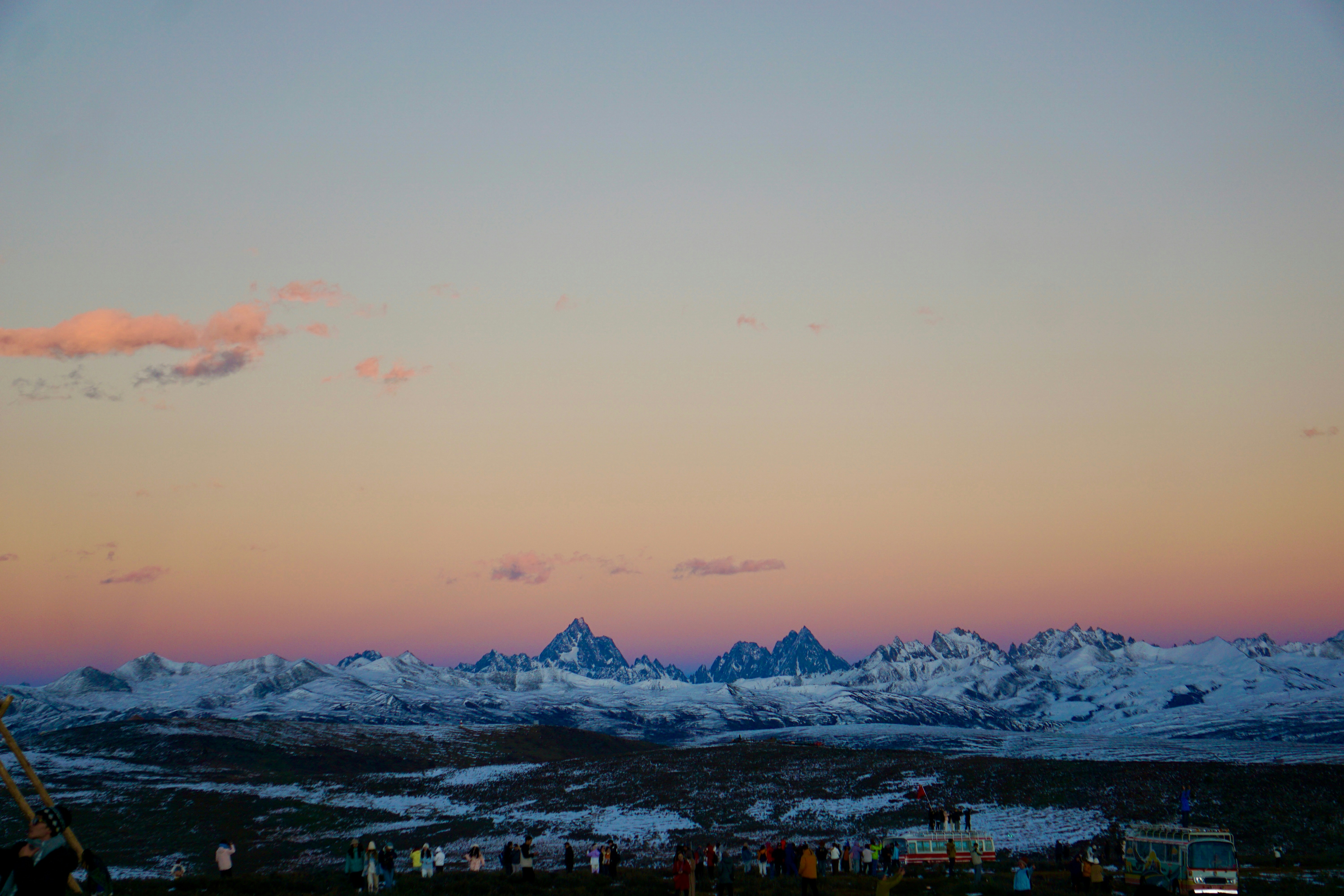Coral Dawn Over a Snowbound Ridge