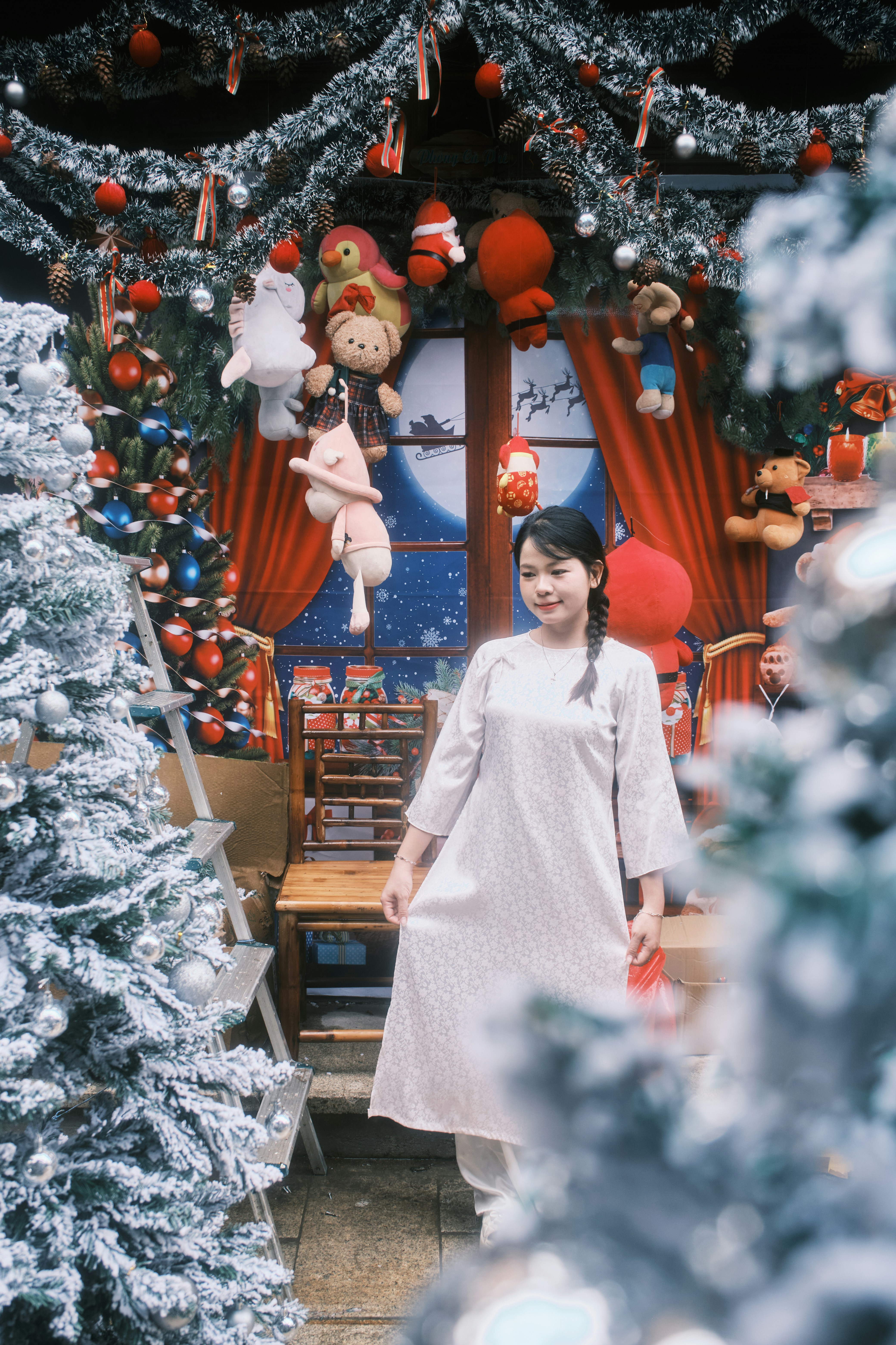 Whimsy in Velvet Snow: Portrait Amid Hanging Plush Ornaments