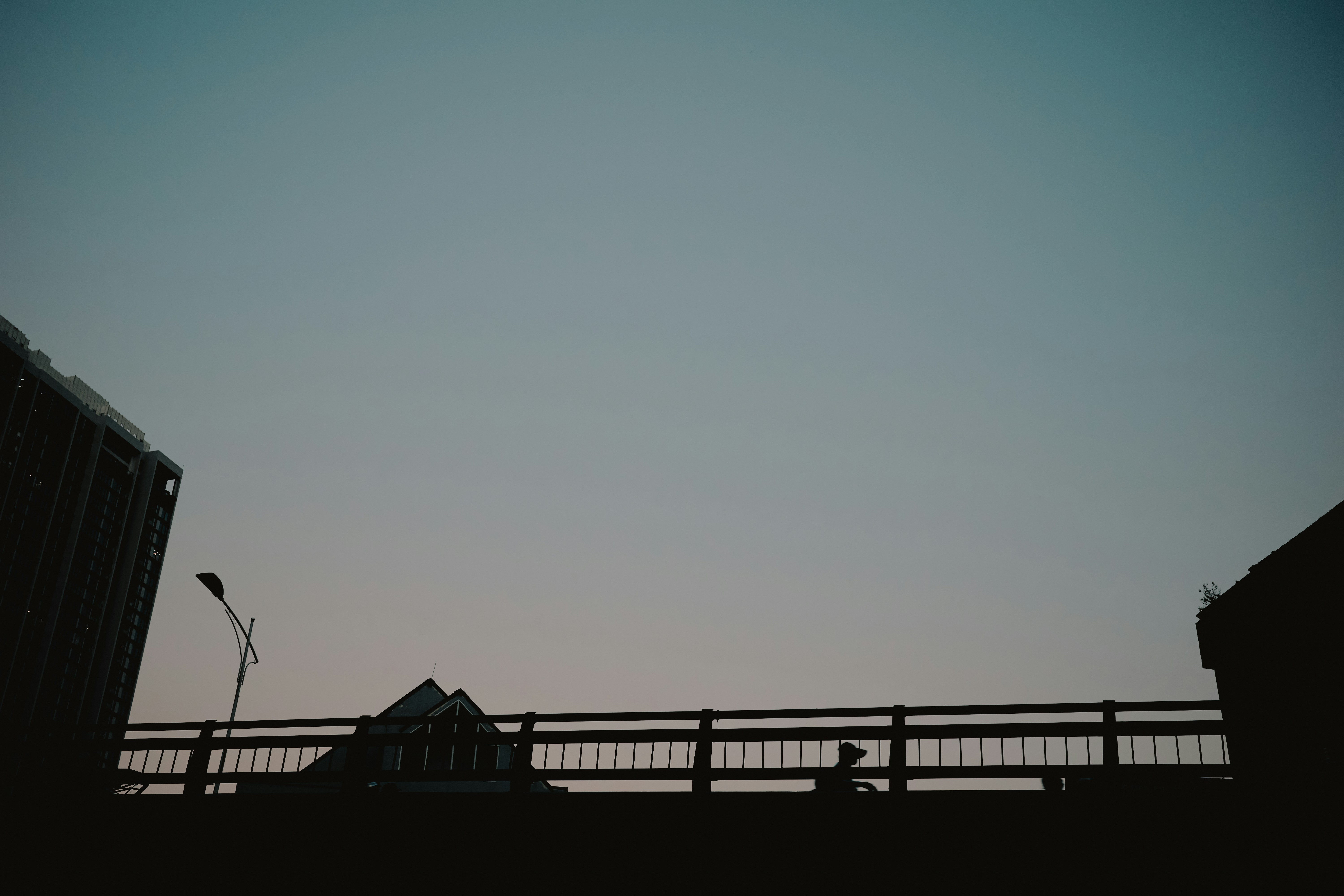 Dusk on the Rooftop Promenade: Quiet Horizon Silhouette