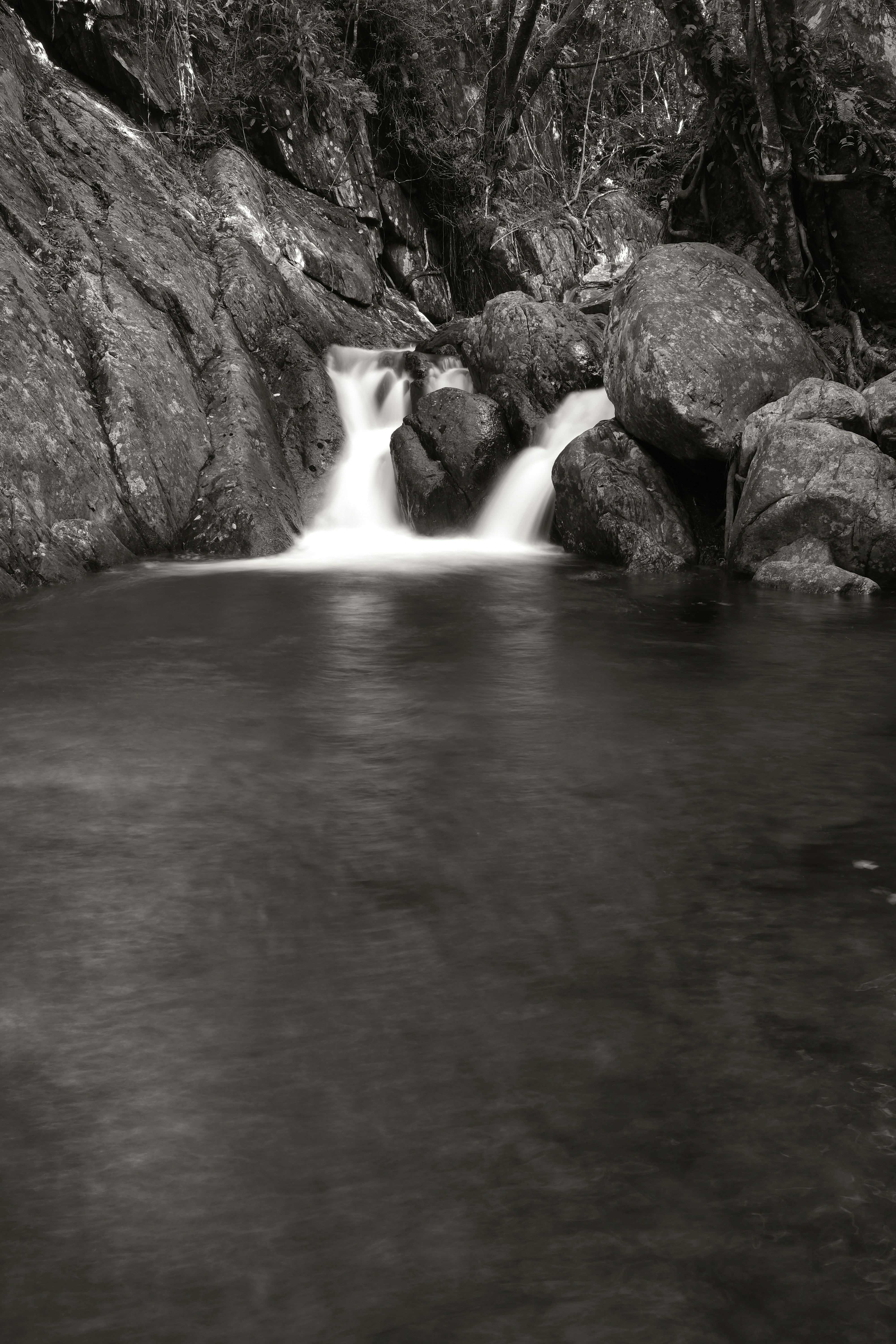 Whispering Cascade Between Granite Giants