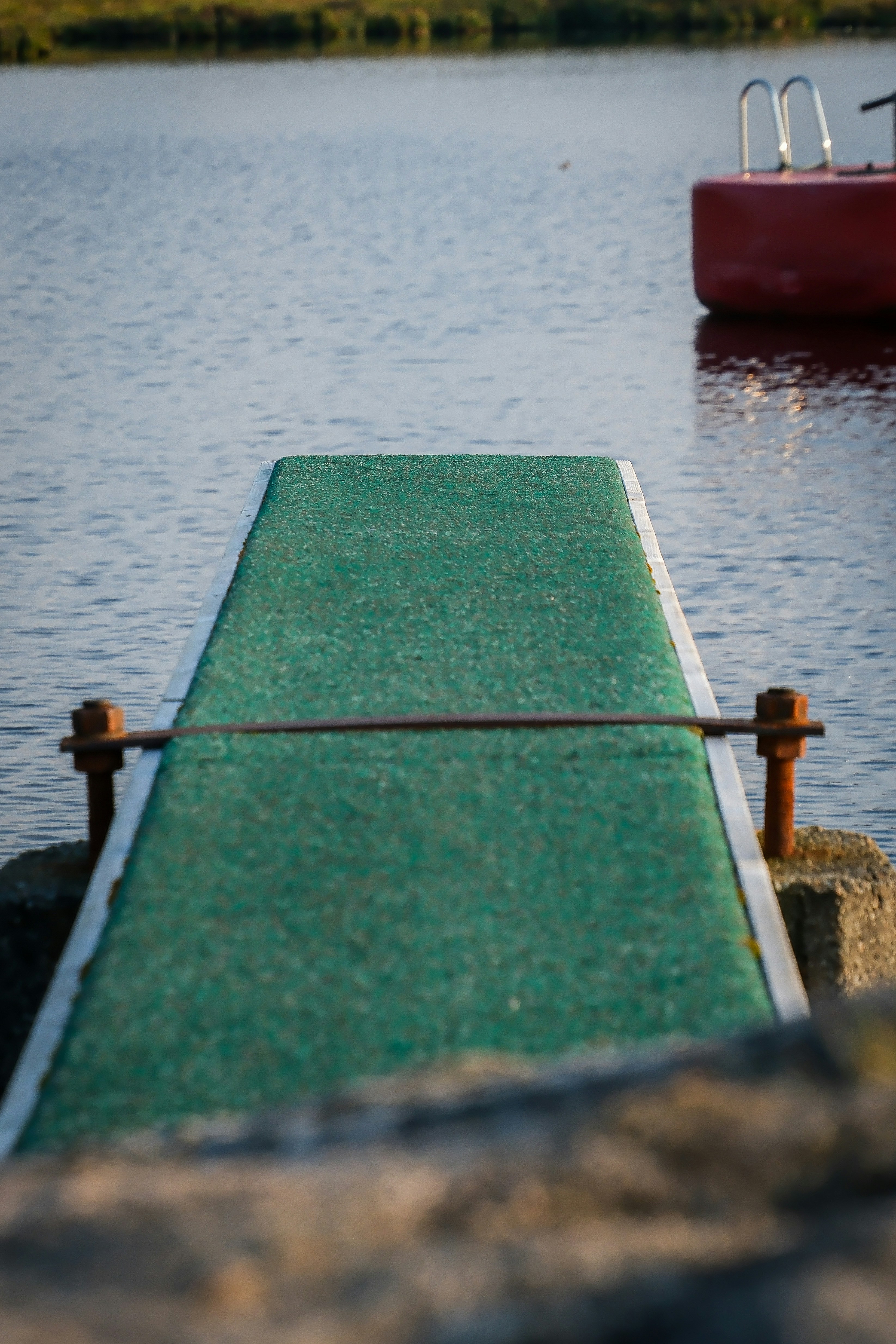 Green Dock Path Reaches Calm Lake